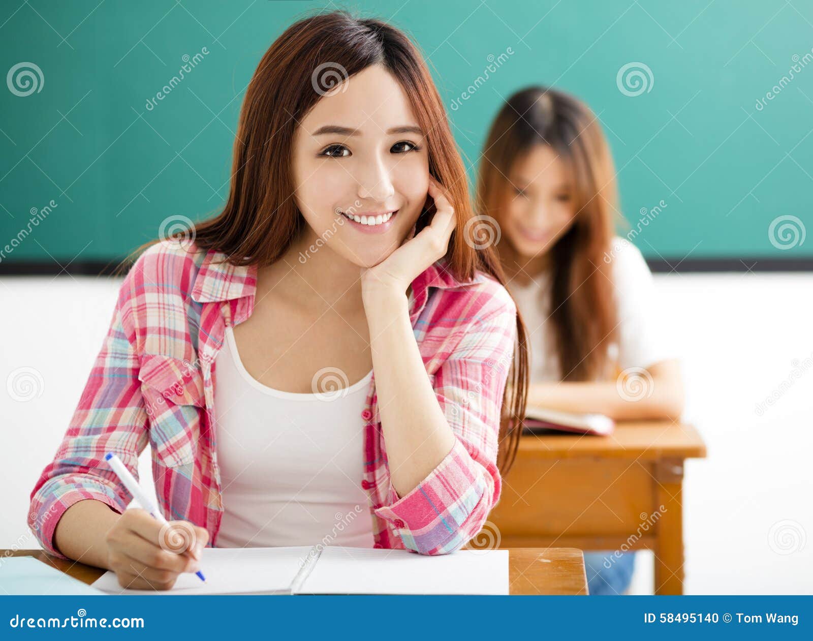 Young Student with Others in the Classroom Stock Photo - Image of books ...