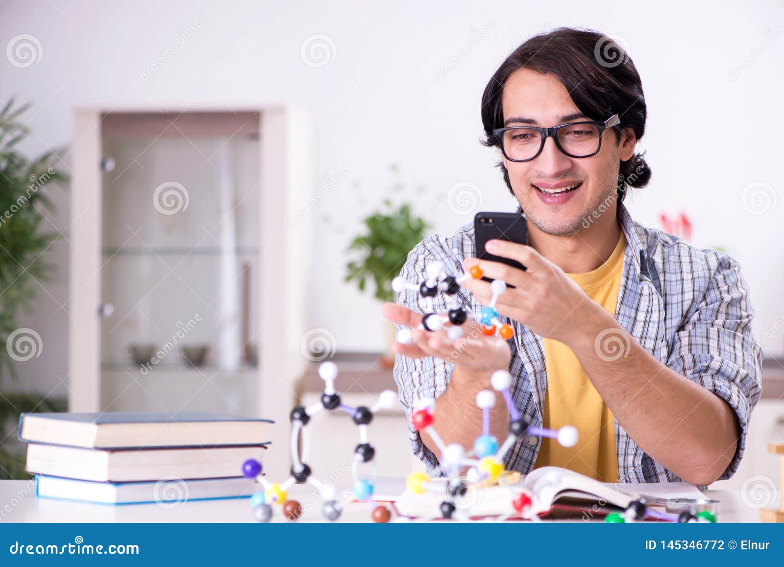 The Young Student Physicist Preparing for Exam at Home Stock Photo ...