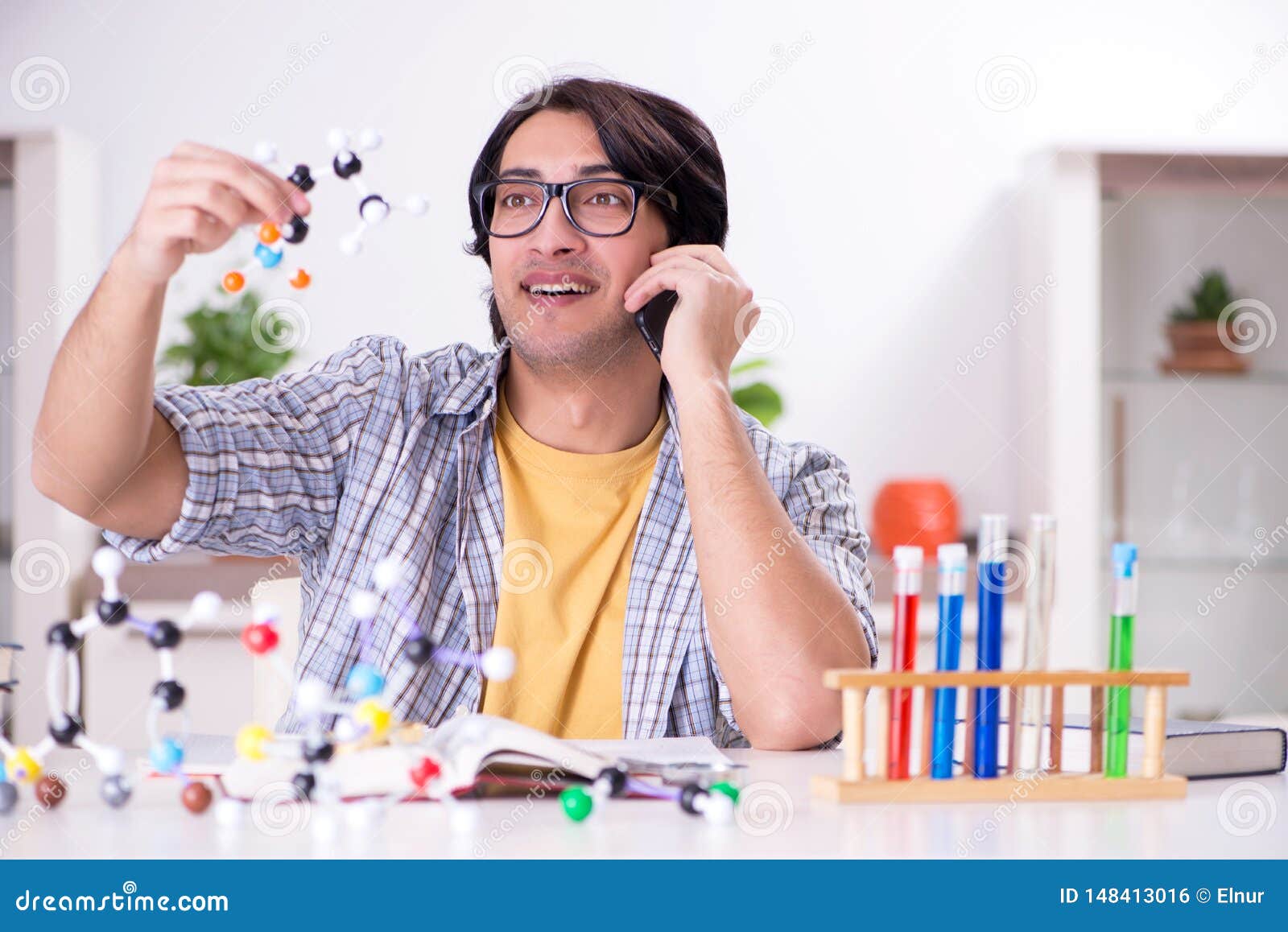 The Young Student Physicist Preparing for Exam at Home Stock Photo ...