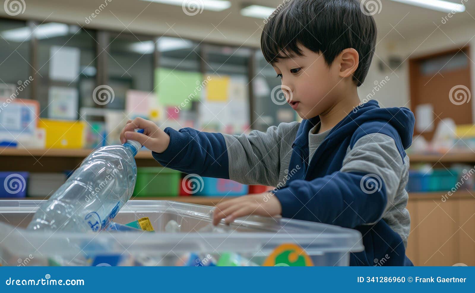 Young Student Practices Environmental Responsibility by Placing a ...