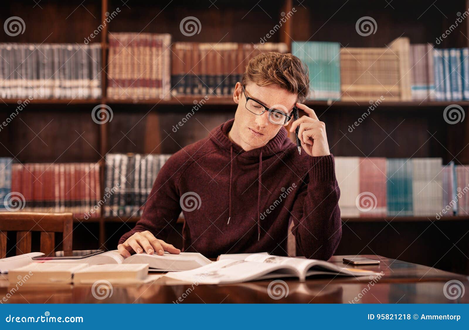 Young Student Preparing for Exam in Library Stock Photo - Image of ...