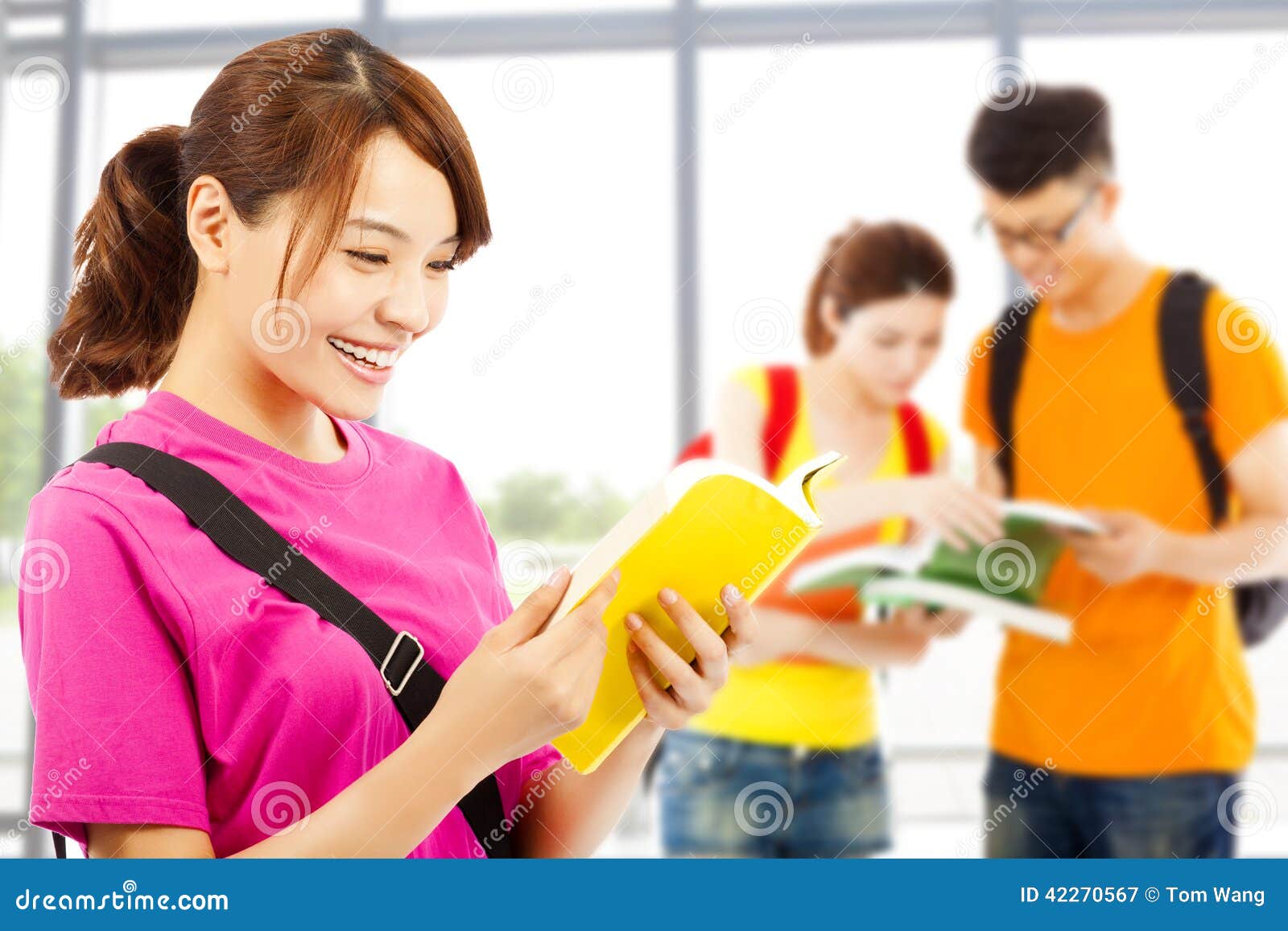 Young Student Read a Book with Classmates at School Stock Image - Image ...