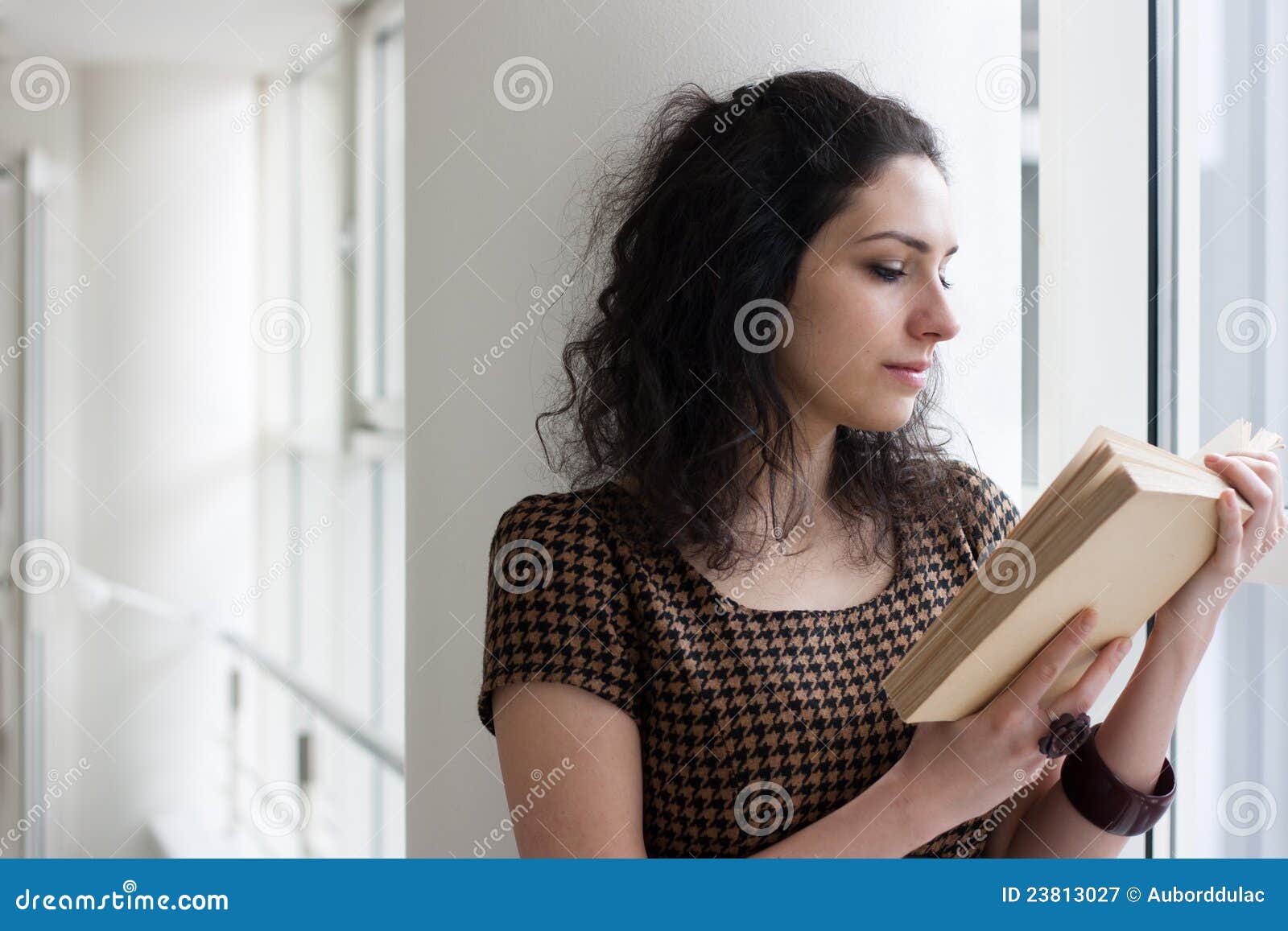 Young Student Reading a Book Stock Image - Image of college, book: 23813027