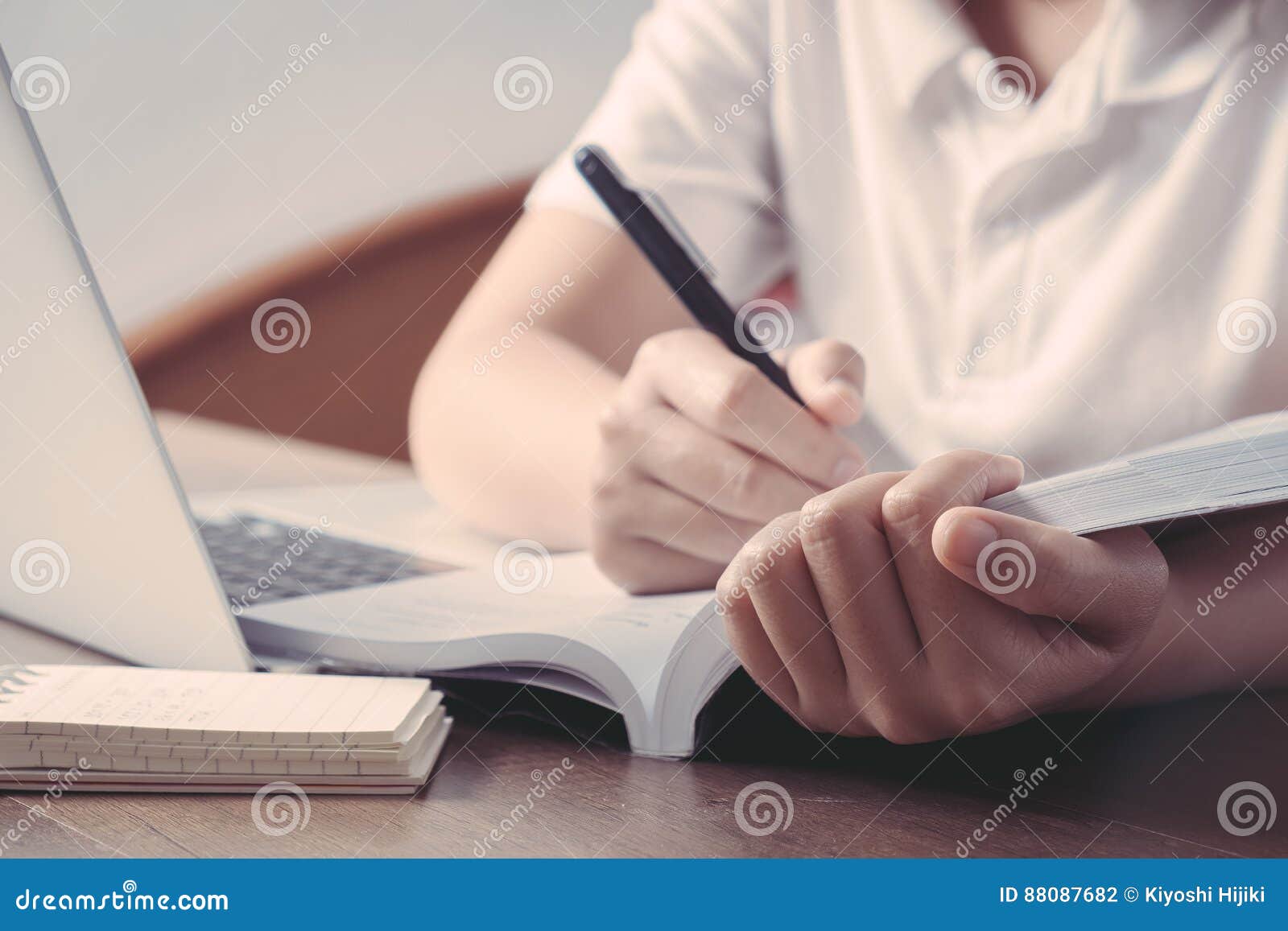 Young Student Reading Book on Desk at Home Stock Photo - Image of desk ...
