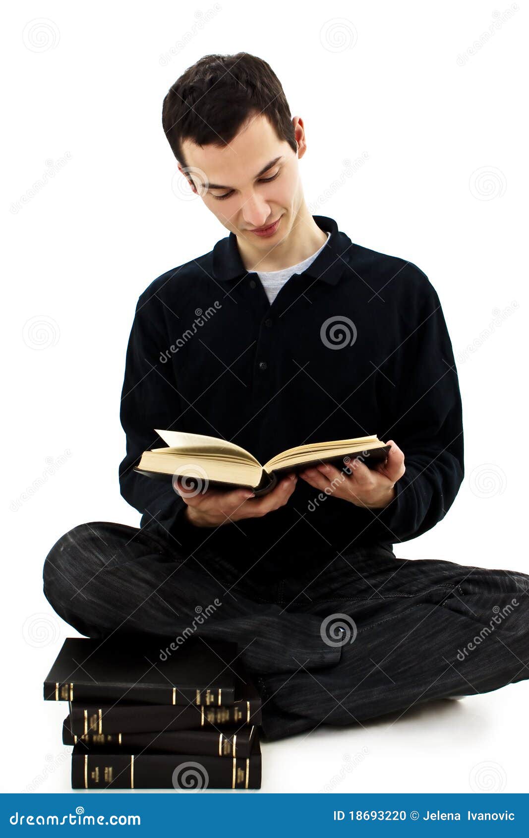 Young Student Reading a Book on the Floor Stock Photo - Image of ...
