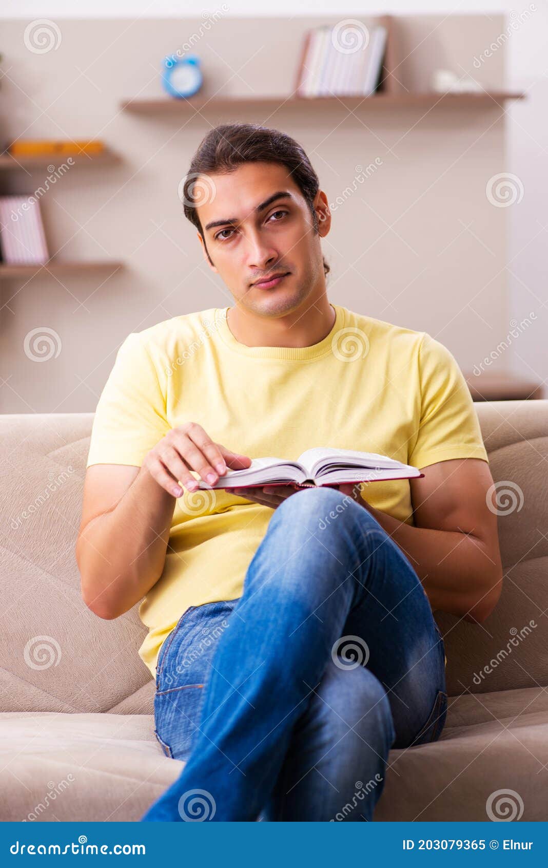 Young Male Student Reading Book at Home Stock Image - Image of ...