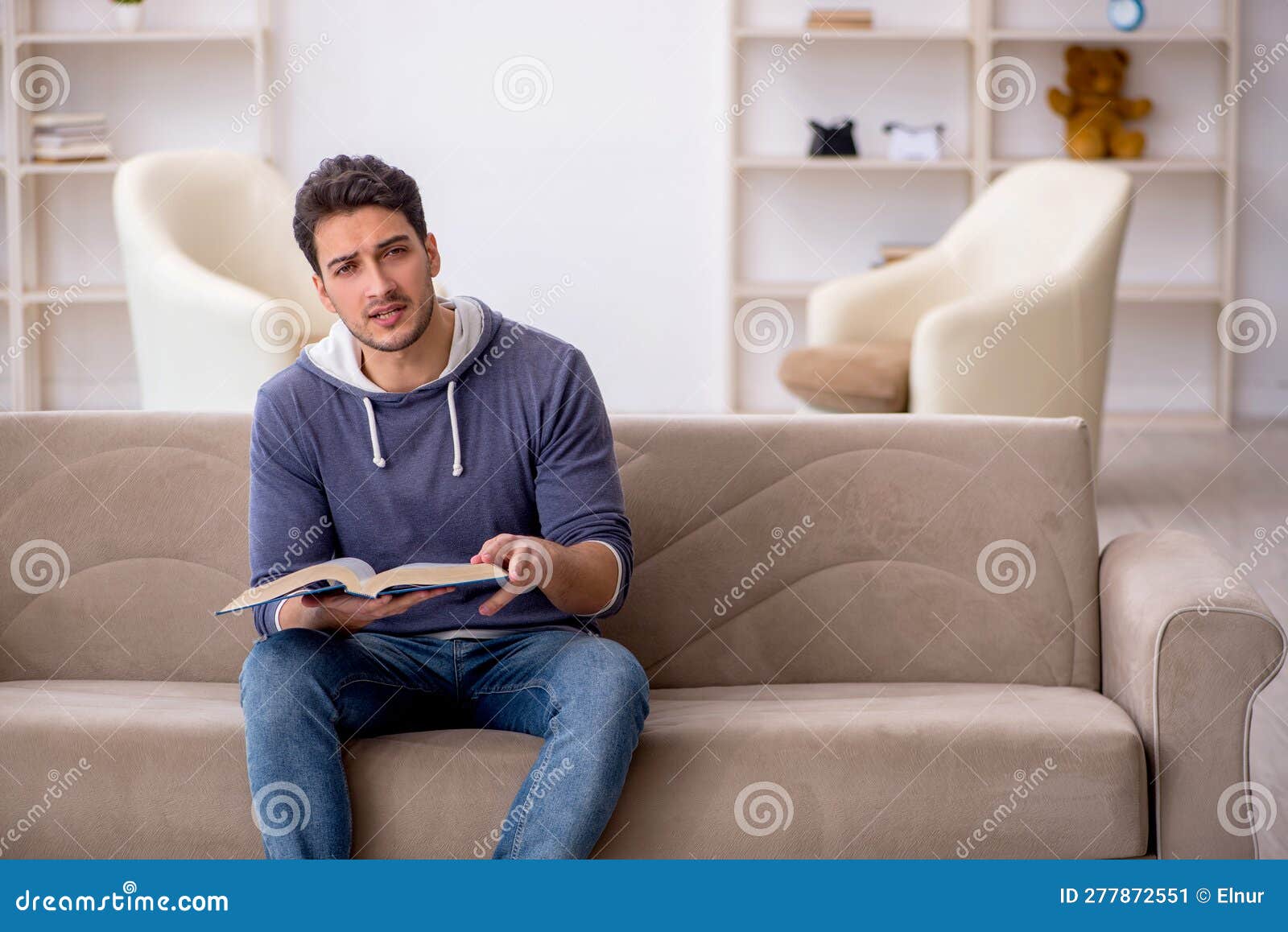 Young Male Student Reading Book at Home Stock Image - Image of academic ...