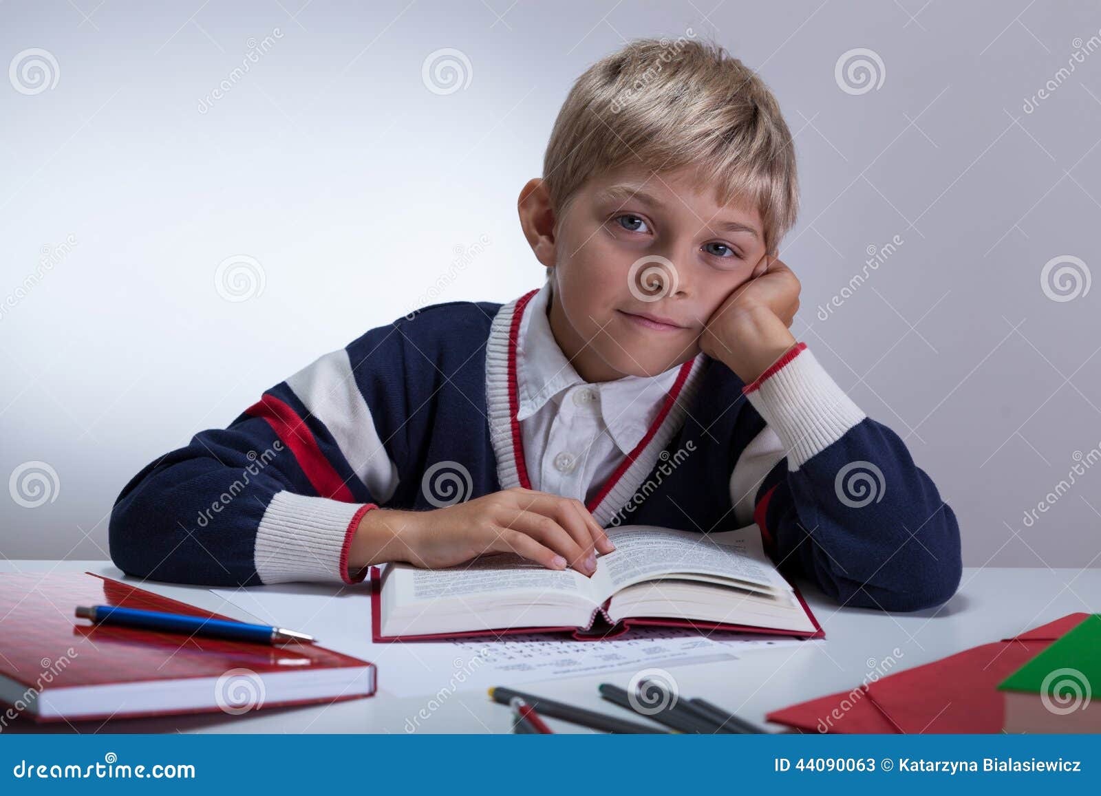 Young Student Reading a Book Stock Image - Image of reading, notes ...