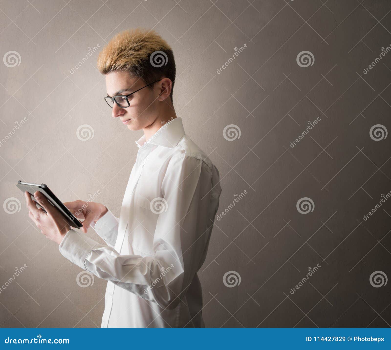 Student reading a tablet stock image. Image of technology - 114427829