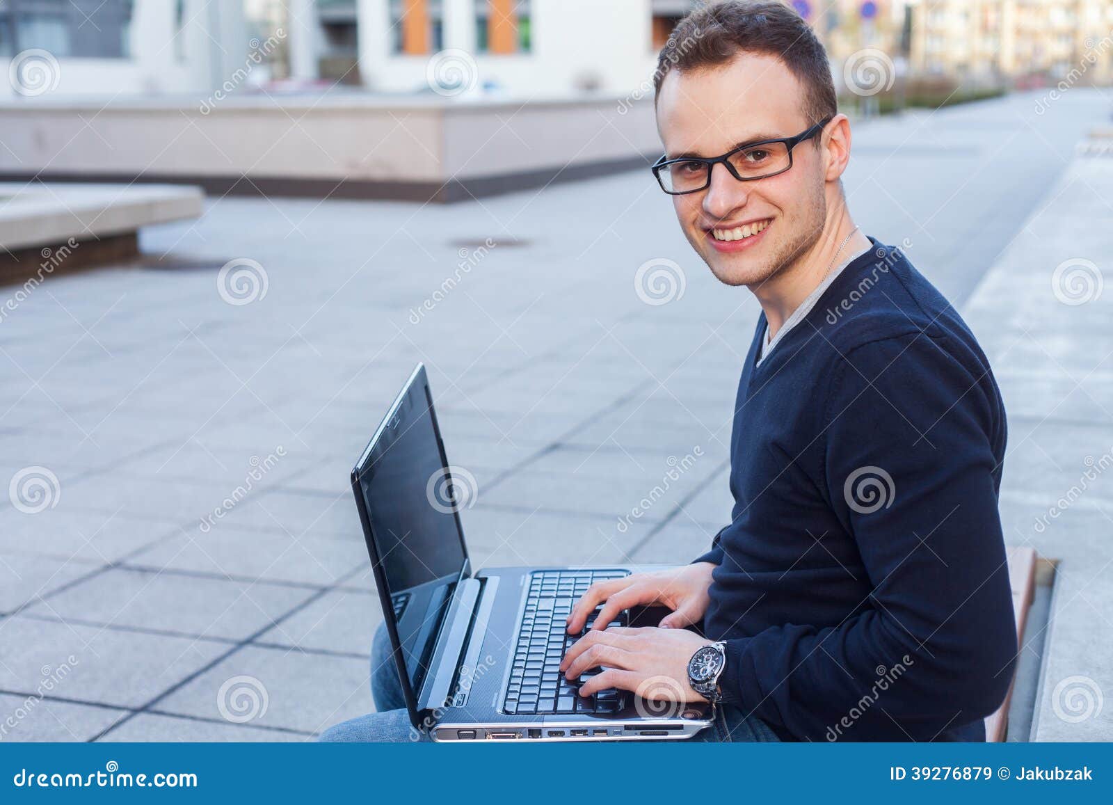 Young Student Sitting on a Bench with Laptop Computer. Stock Image ...
