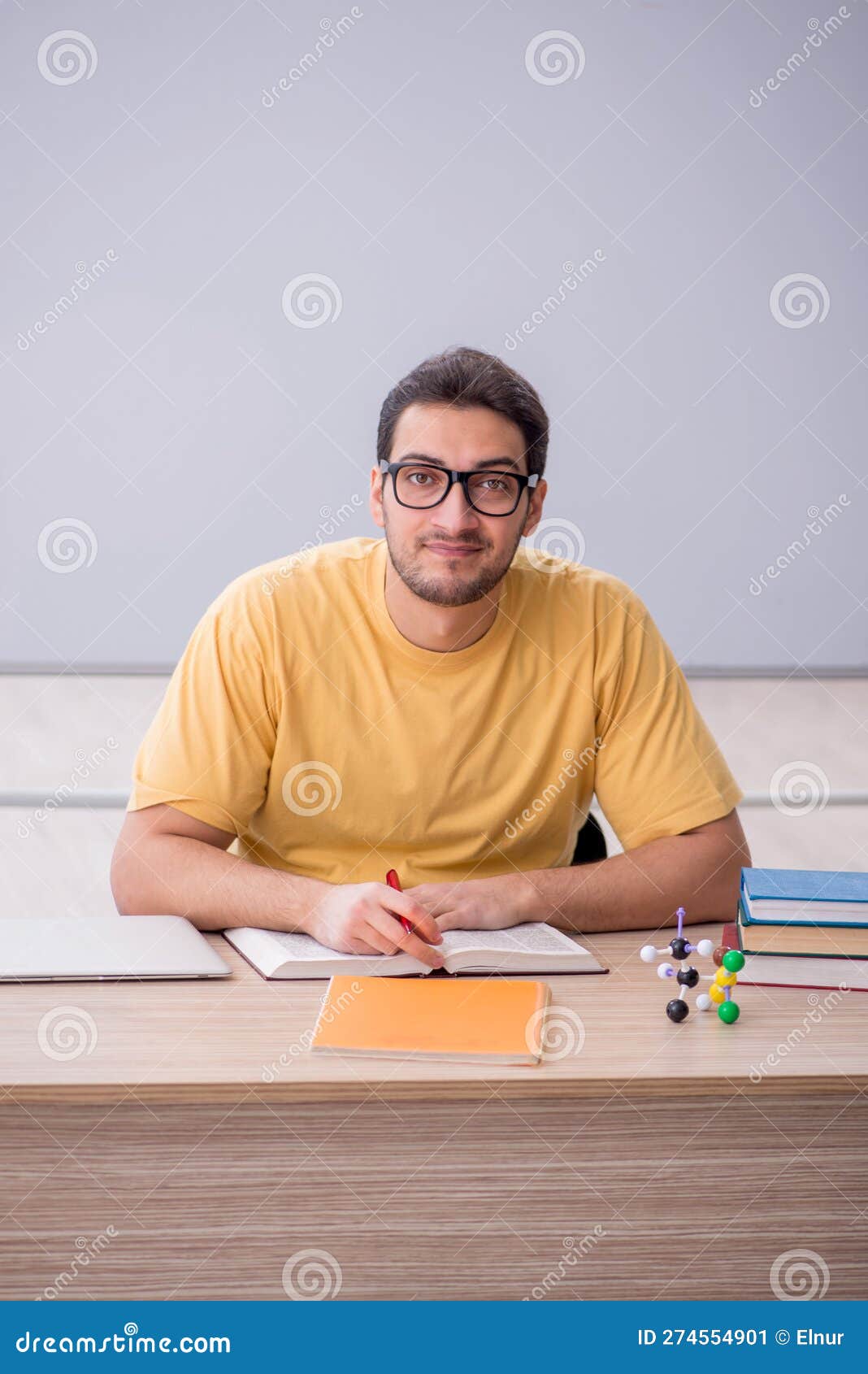 Young Male Student Sitting in the Classroom Stock Image - Image of ...