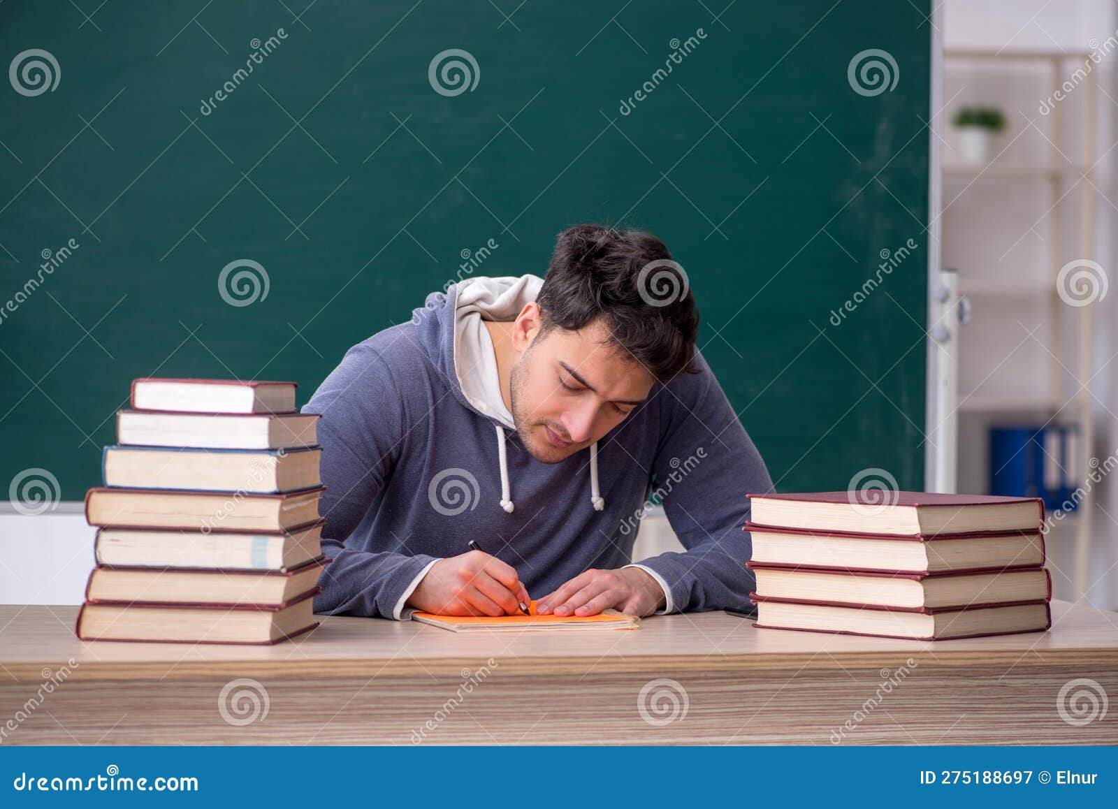 Young Male Student Sitting in the Classroom Stock Image - Image of ...