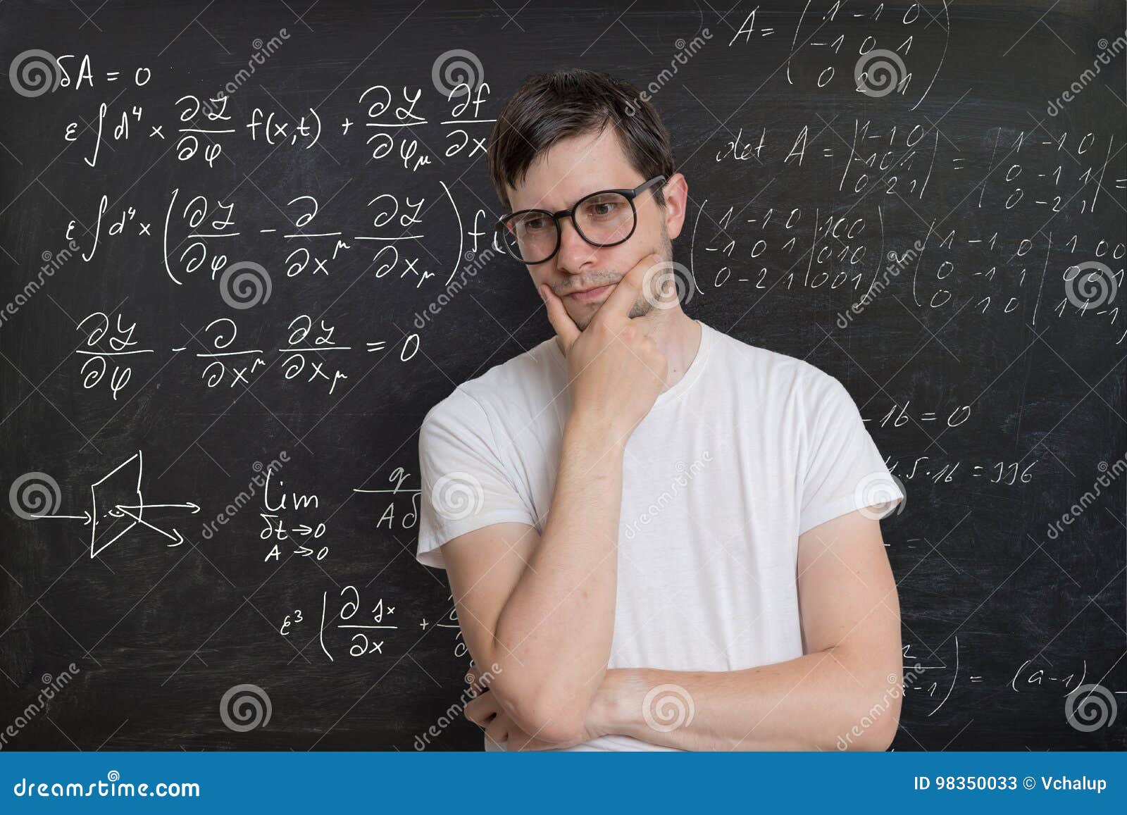 Young Student is Solving Math Exam. Mathematics Formular on Blackboard ...