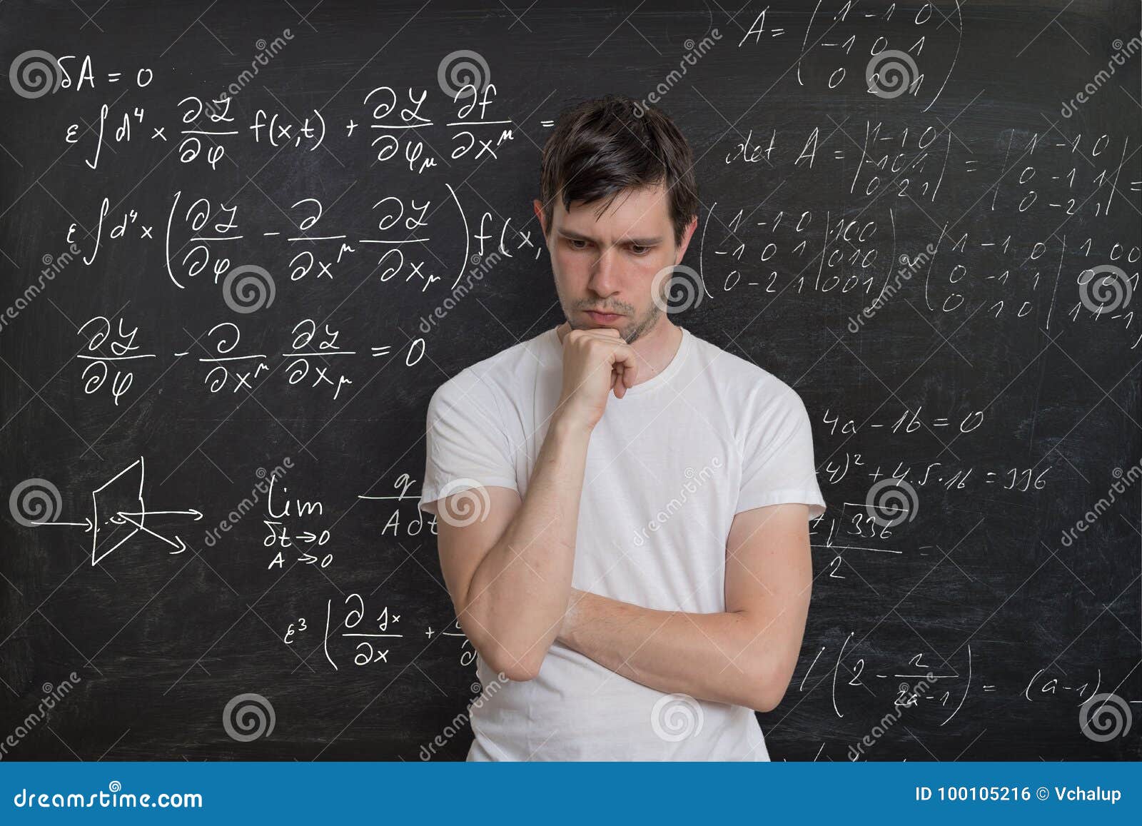 Young Student is Solving Math Exam. Mathematics Formular on Blackboard ...