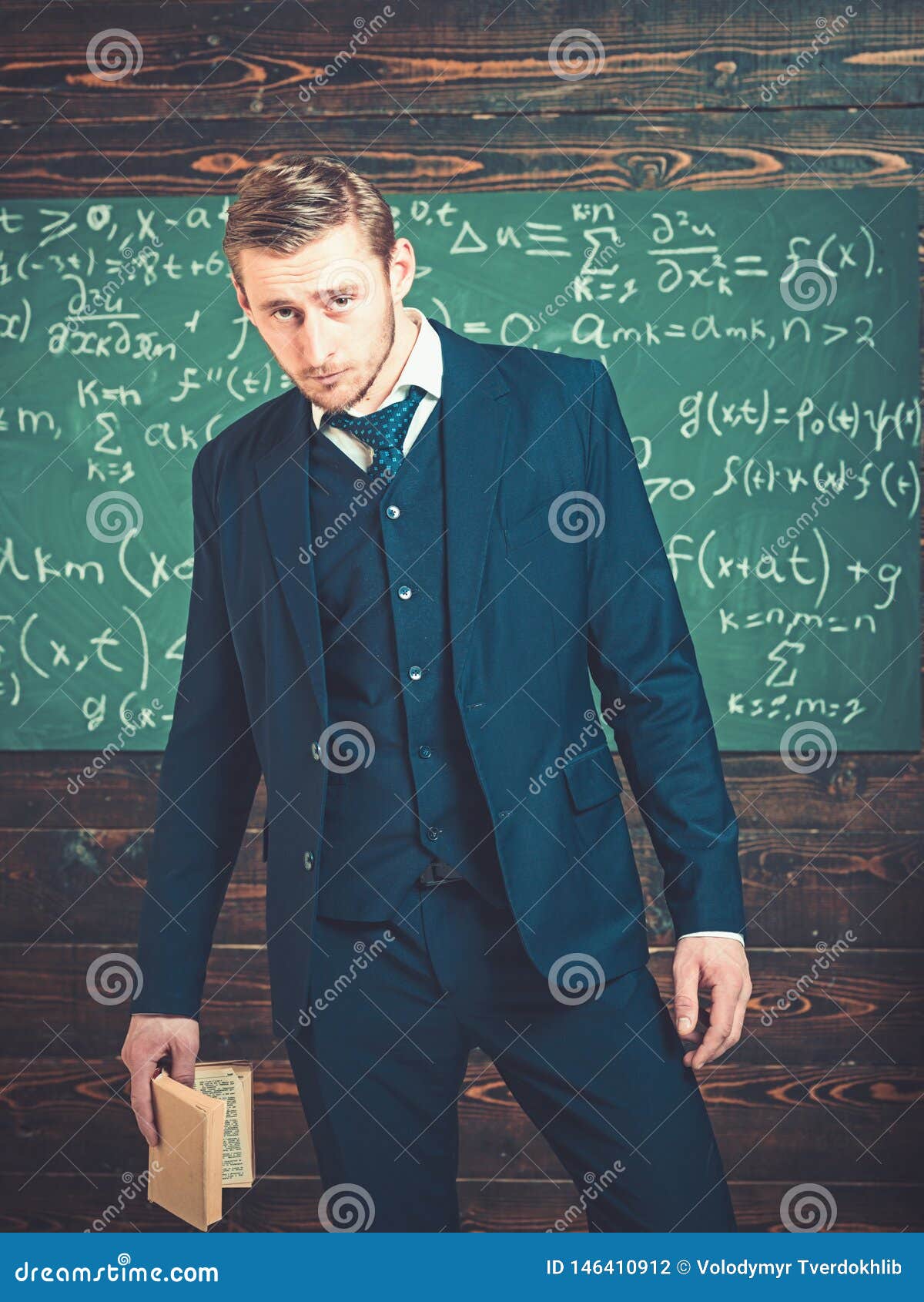 Young Student Standing with Book in His Hand. Gentleman in Suit and Tie ...