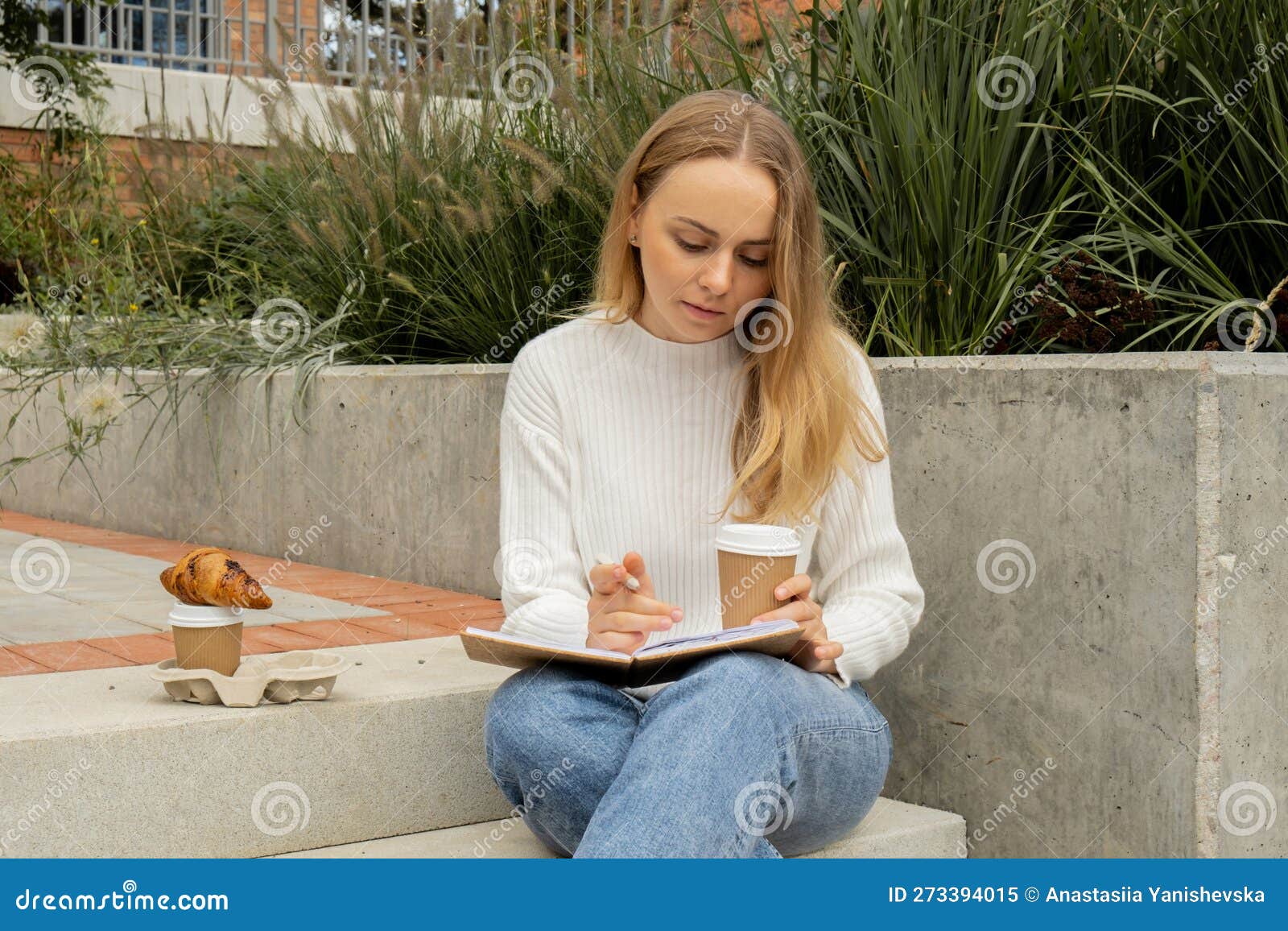 Young Student Study with Notebook in Park. Drinking Coffee and Eat ...