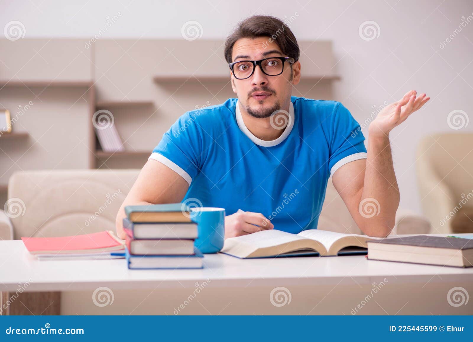 Young Male Student Studying at Home Stock Image - Image of reading ...