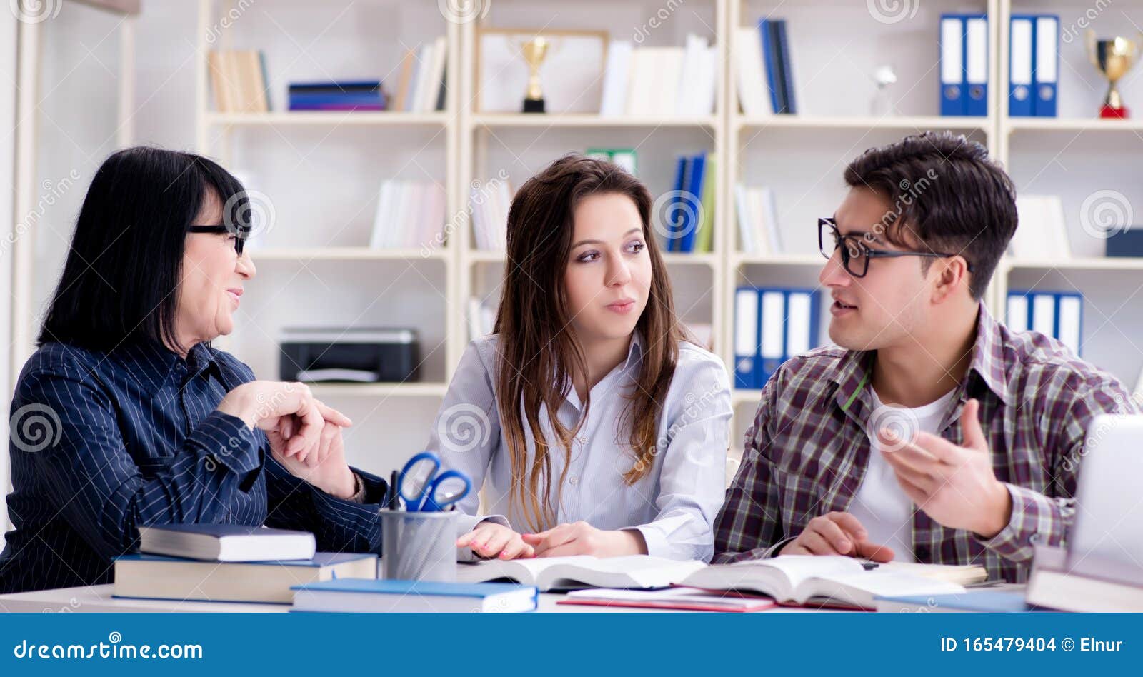 Young Student and Teacher during Tutoring Lesson Stock Photo - Image of ...