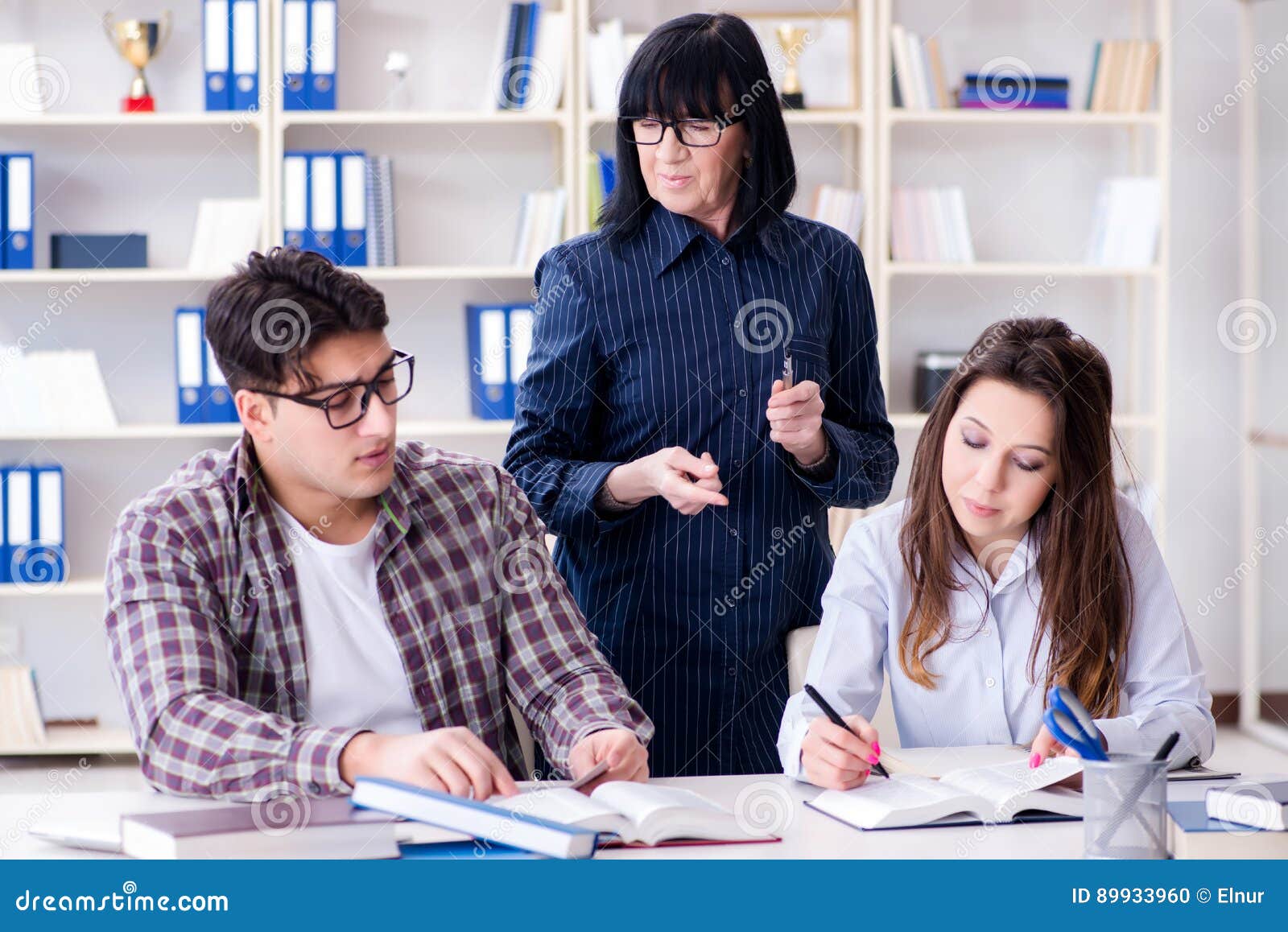 The Young Student and Teacher during Tutoring Lesson Stock Photo ...