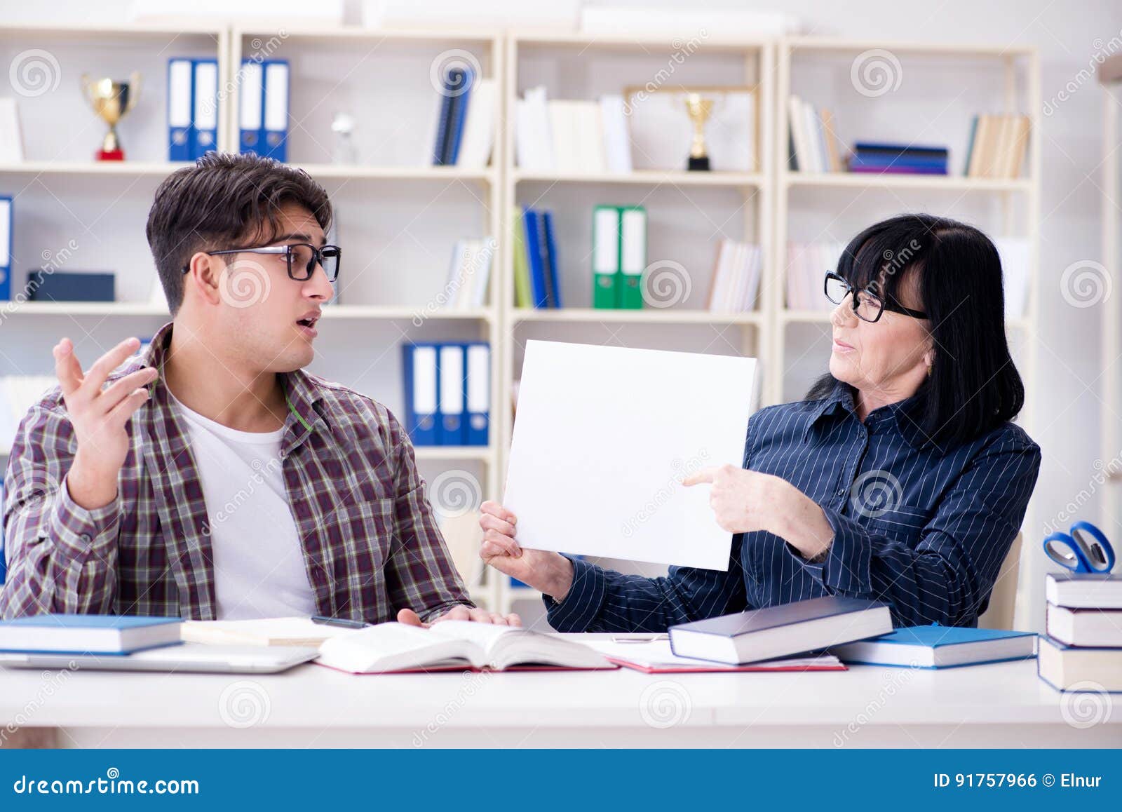 The Young Student and Teacher during Tutoring Lesson Stock Photo ...