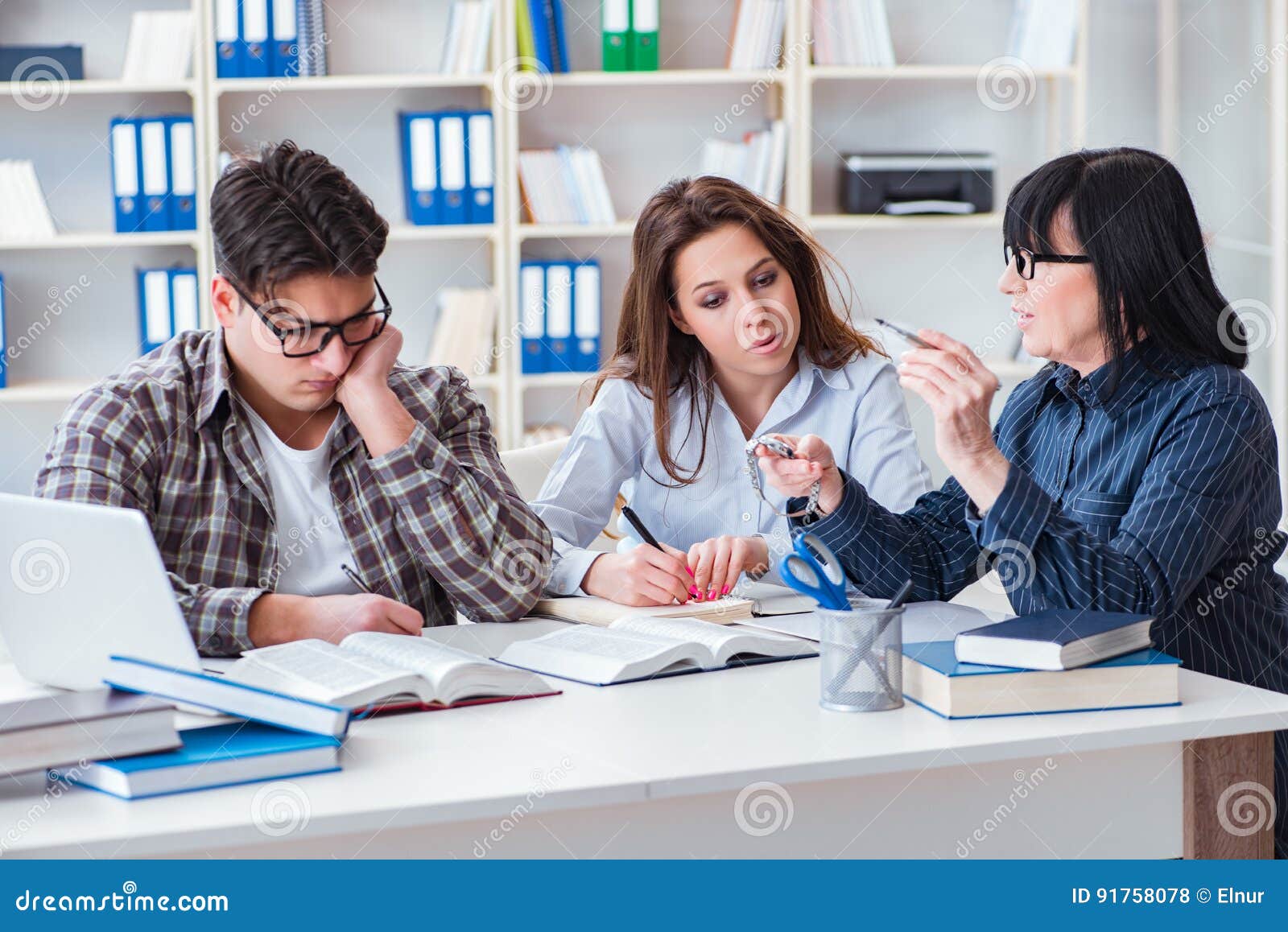 The Young Student and Teacher during Tutoring Lesson Stock Photo ...
