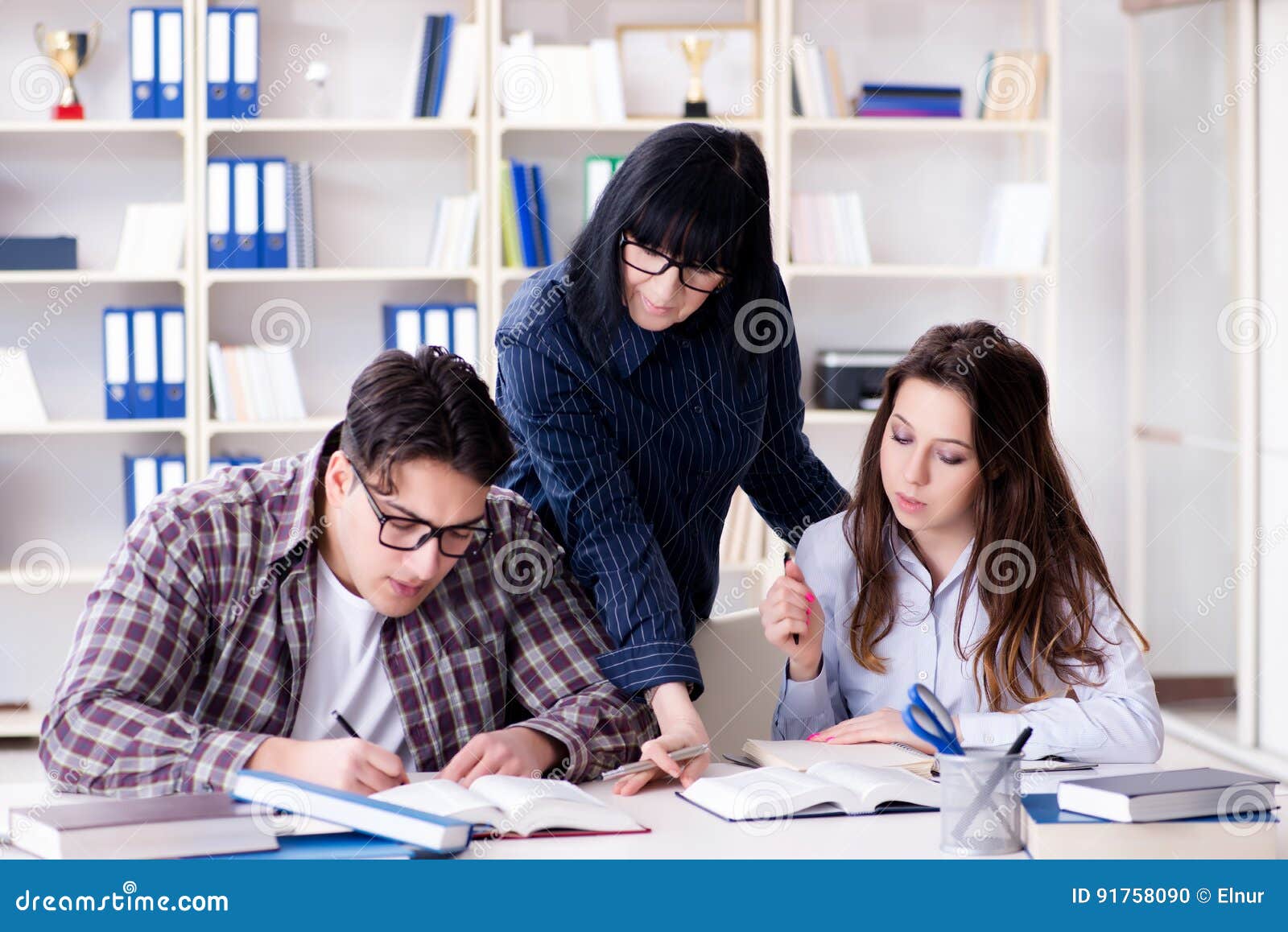 The Young Student and Teacher during Tutoring Lesson Stock Photo ...