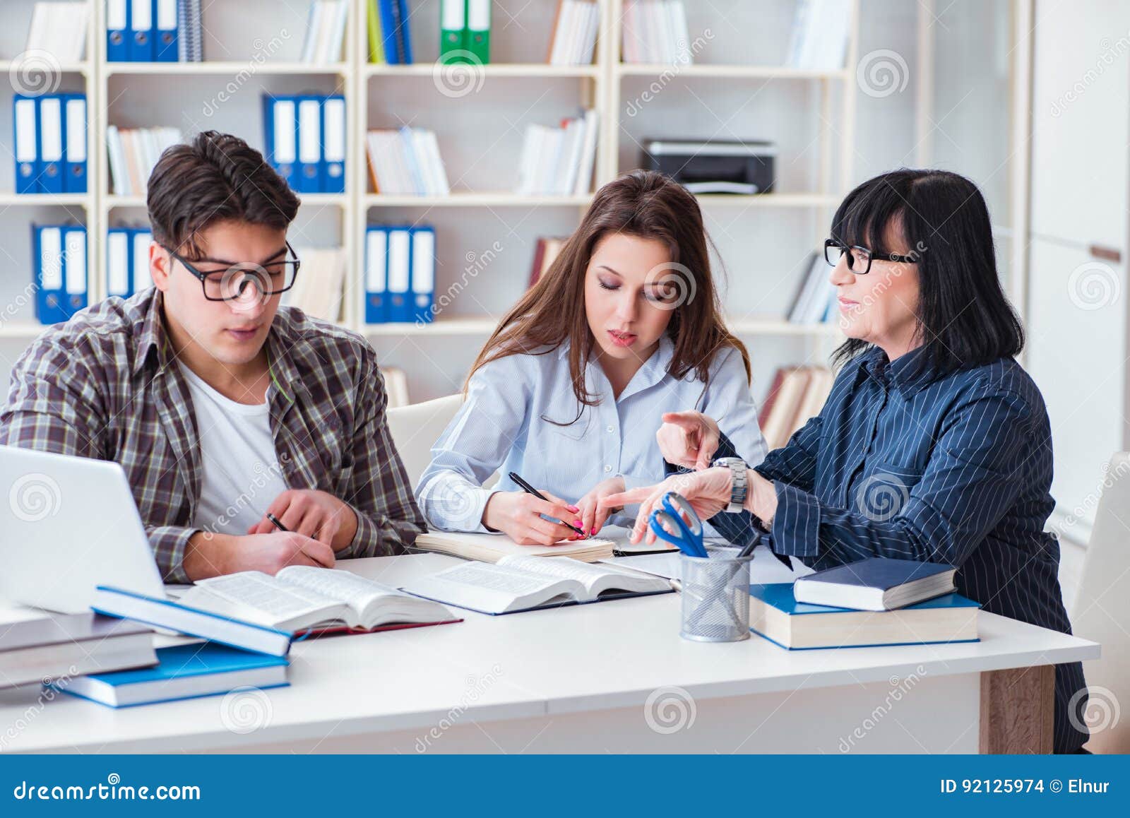 The Young Student and Teacher during Tutoring Lesson Stock Photo ...