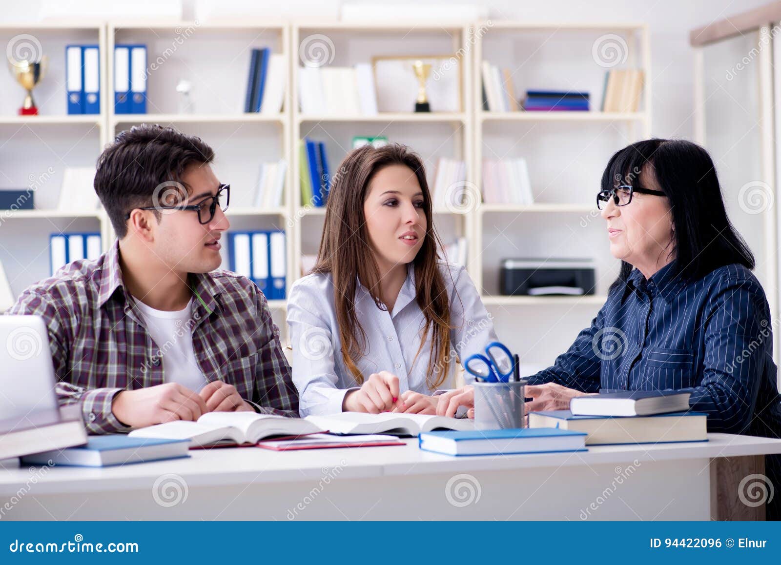 The Young Student and Teacher during Tutoring Lesson Stock Photo ...