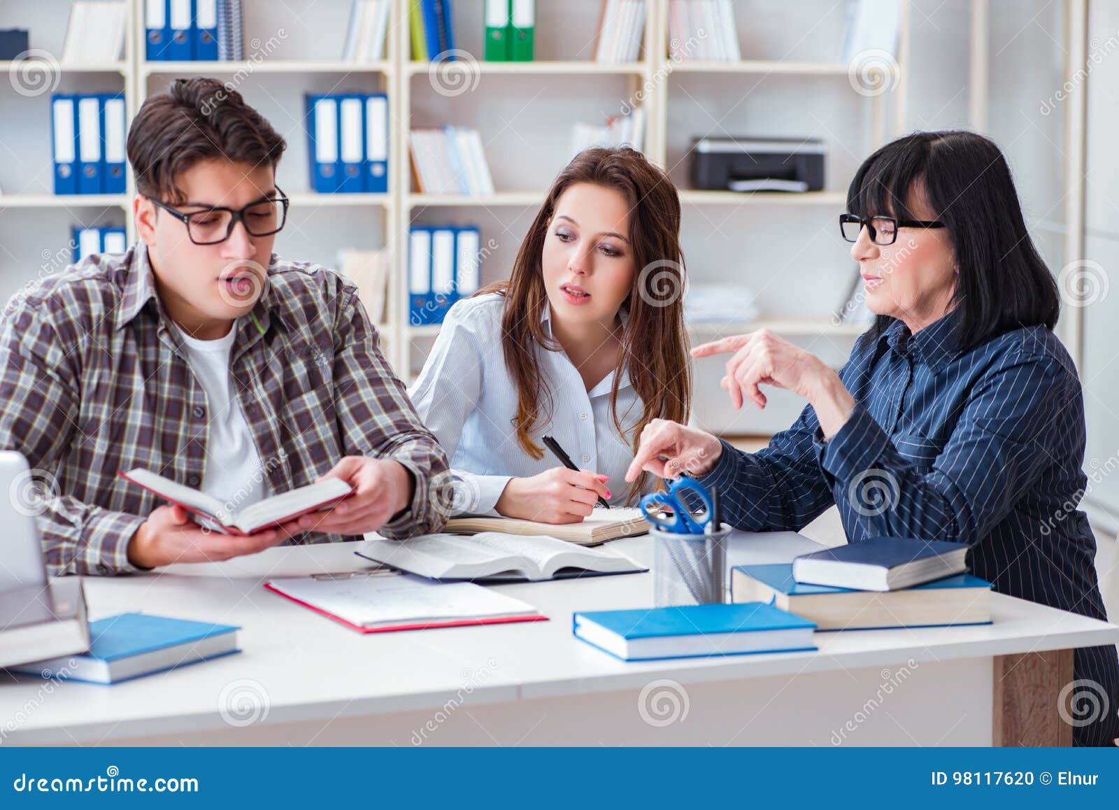 The Young Student and Teacher during Tutoring Lesson Stock Photo ...