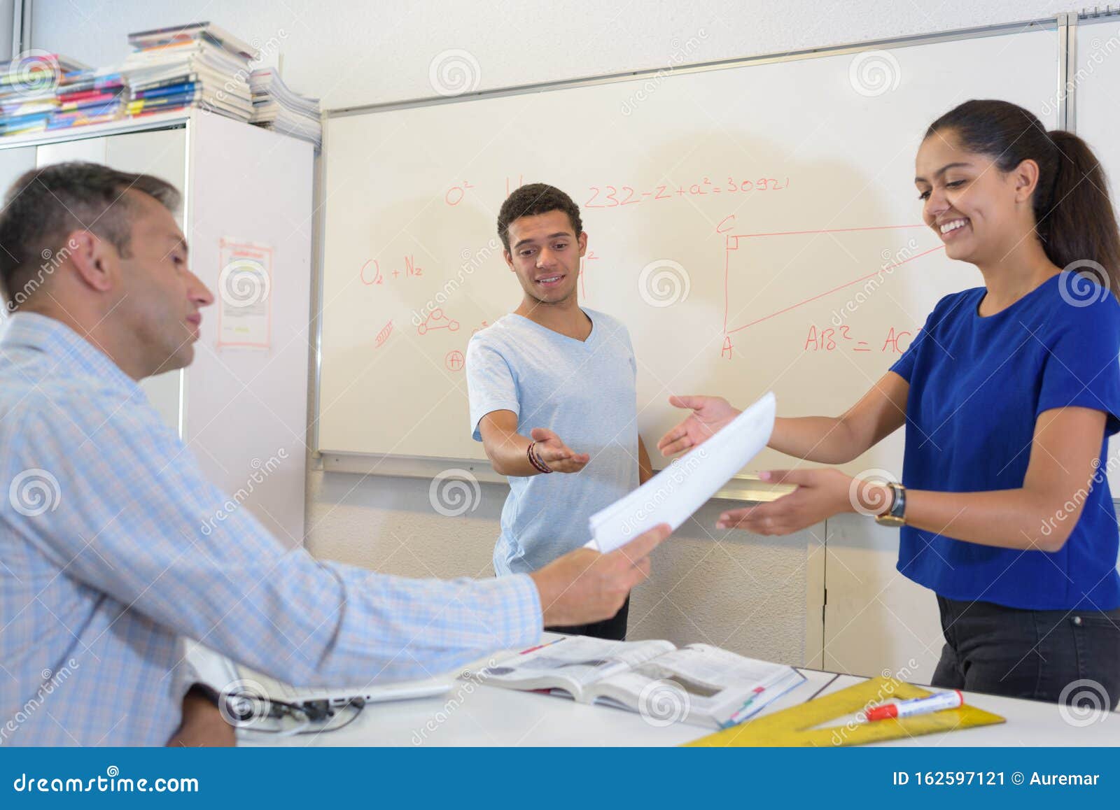 Young Student and Teacher Working on Draft on Board Stock Image - Image ...