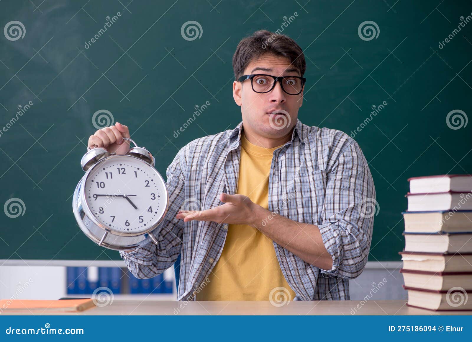 Young Male Student in Time Management Concept Stock Photo - Image of ...