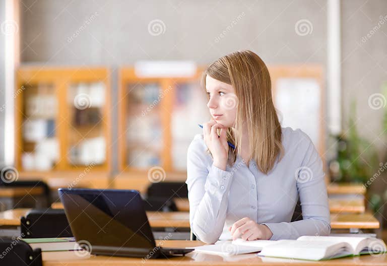 Young Student Using Computer in a Library. Looking Away Stock Image ...