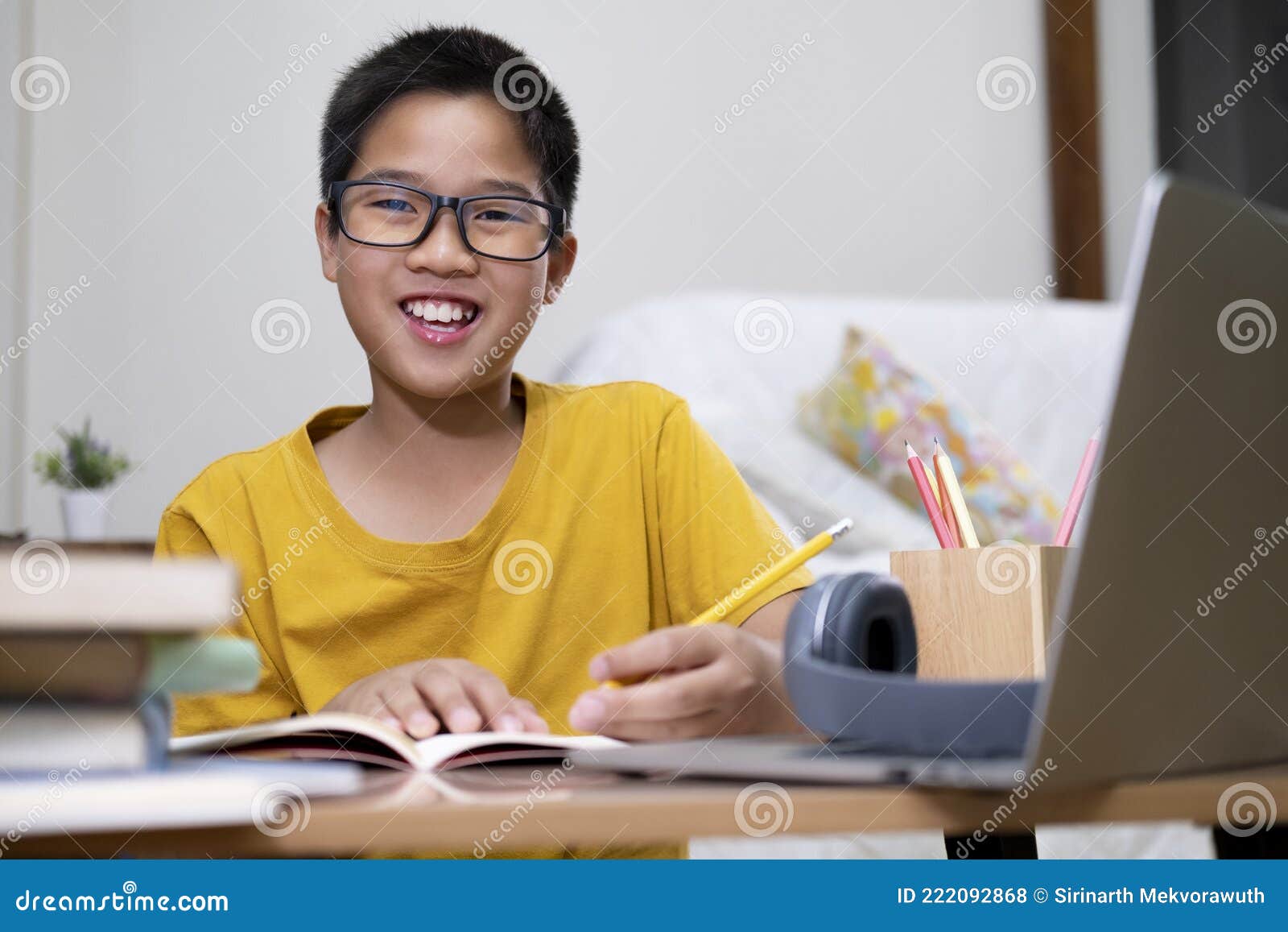 Young Student Using Computer and Mobile Device Studying Online Stock ...