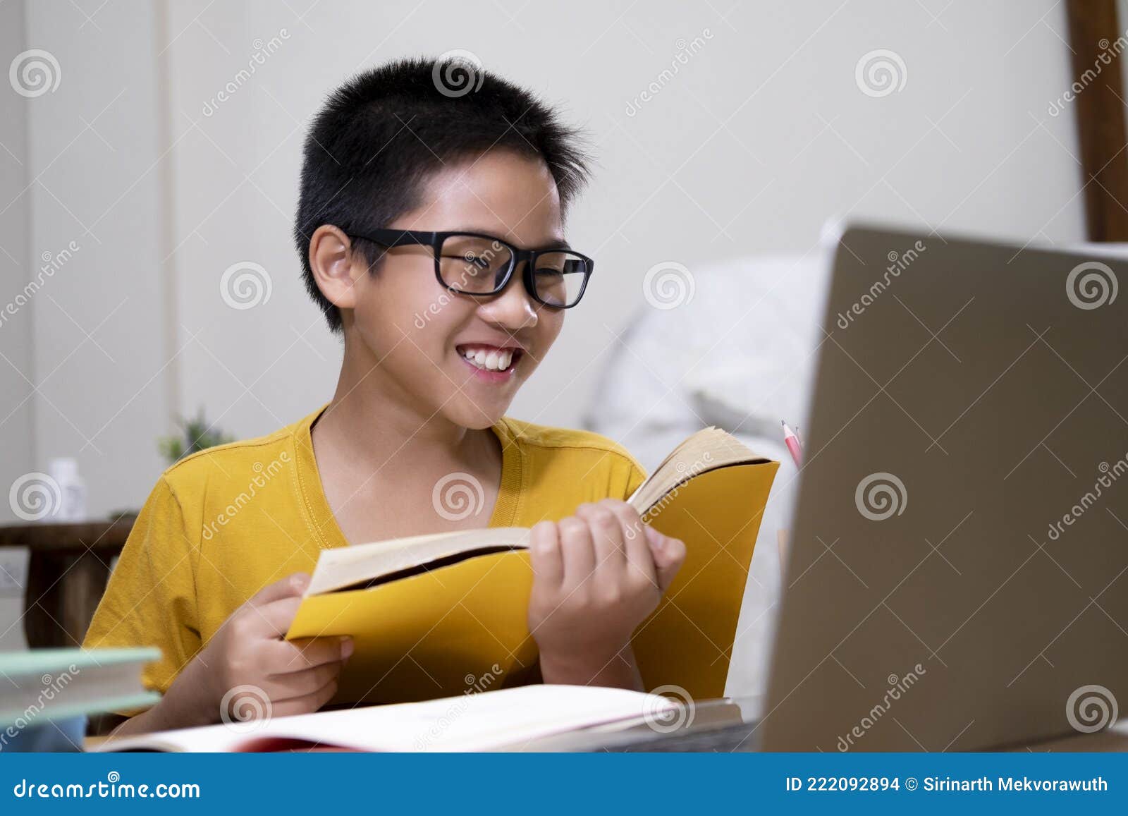 Young Student Using Computer and Mobile Device Studying Online Stock ...