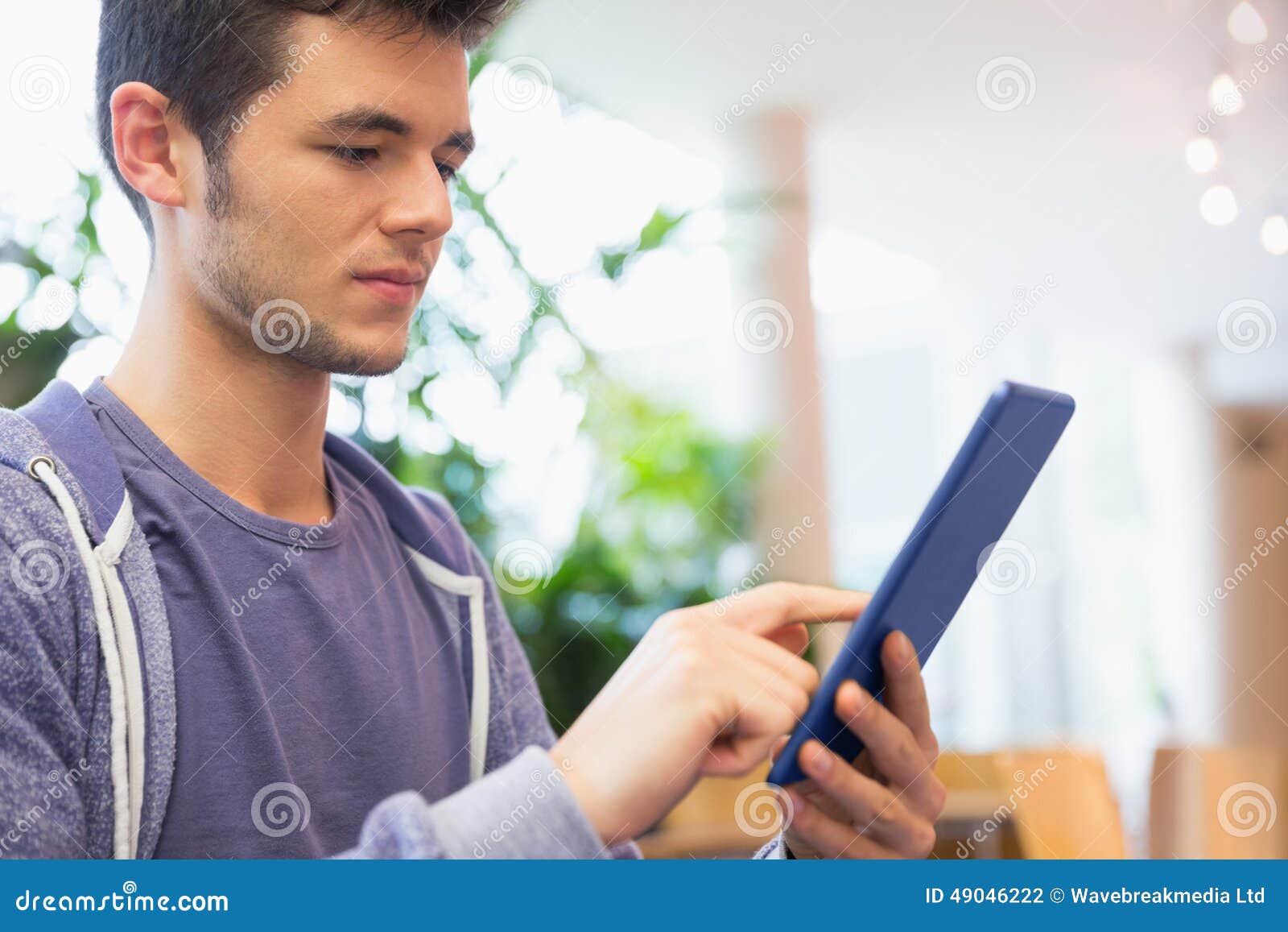 Young Student Using His Tablet in Cafe Stock Photo - Image of ...