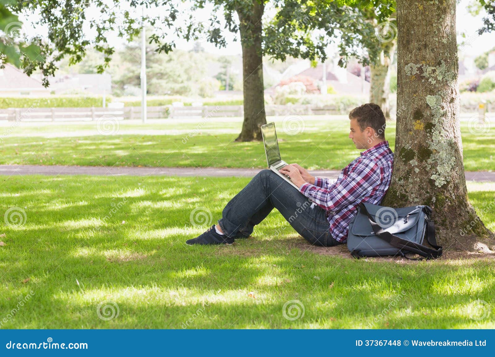 Young Student Using Laptop Outside Stock Photo - Image of university ...