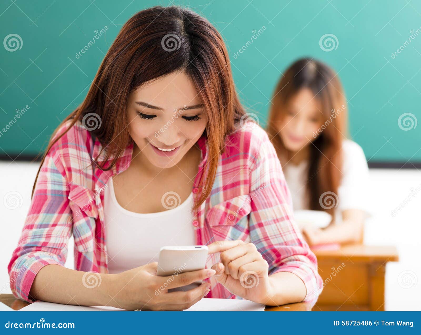 Young Student Using Smart Phone in Classroom Stock Photo - Image of ... Young Student Using Smart Phone in Classroom Stock Photo - Image of ...