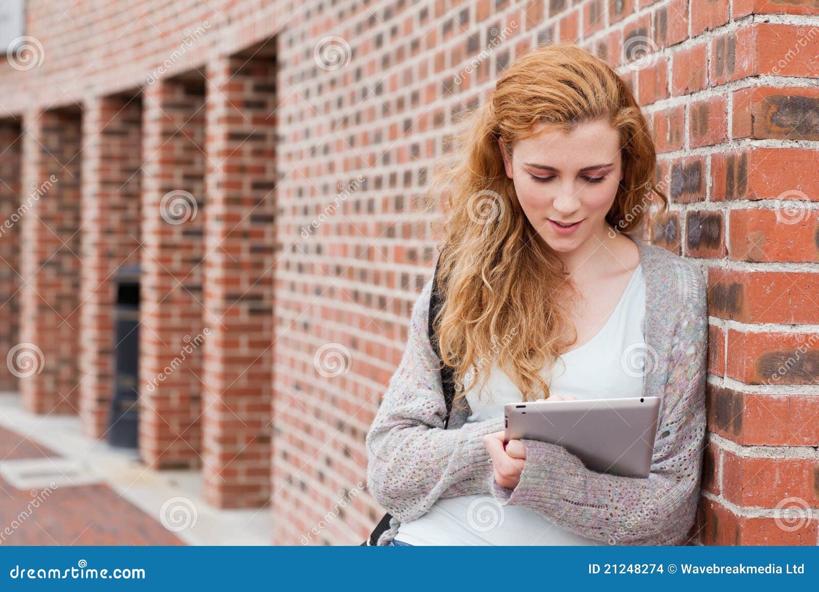 Young Student Using a Tablet Computer Stock Photo - Image of reading ...
