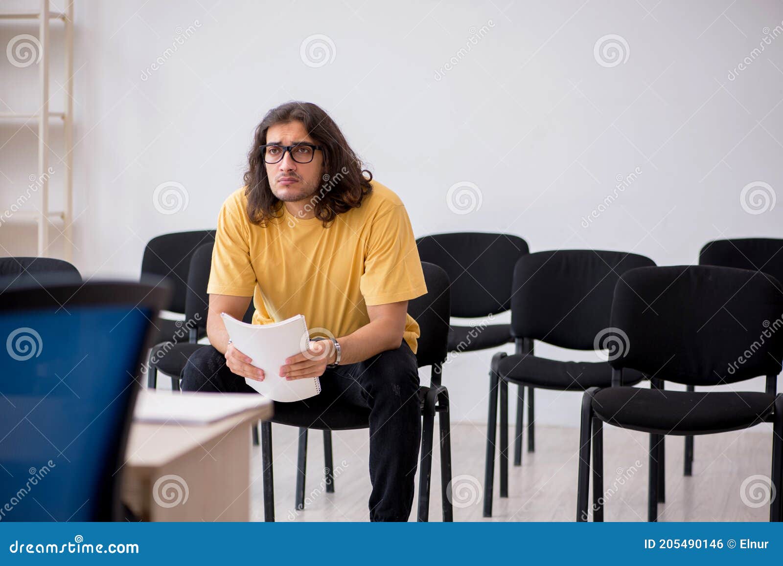 Young Male Student Waiting for Teacher in the Classroom Stock Photo ...