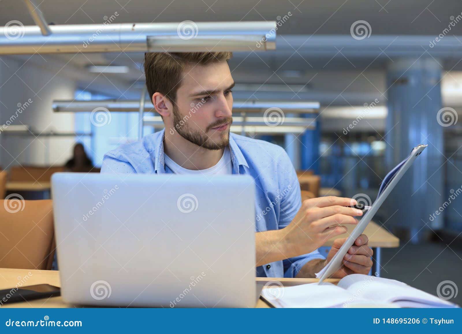 Young Student Working on Laptop in Library Stock Photo - Image of male ...