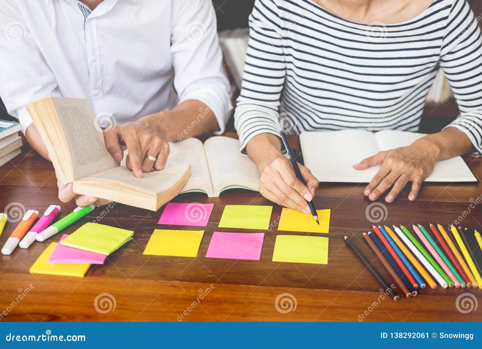 Young Students Classmates Help Friend Catching Up Workbook and Learning ...