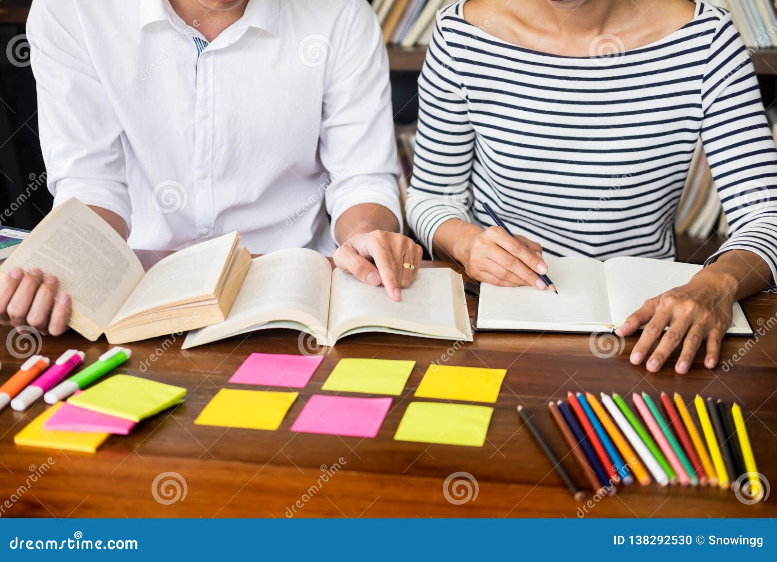 Young Students Classmates Help Friend Catching Up Workbook and Learning ...