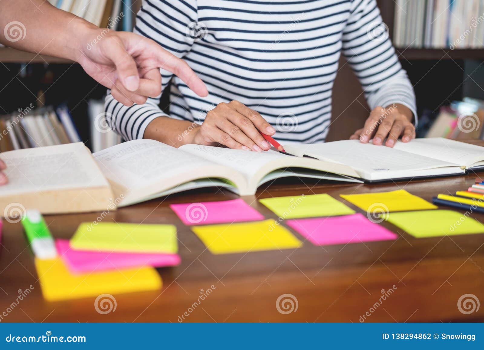 Young Students Classmates Help Friend Catching Up Workbook and Learning ...