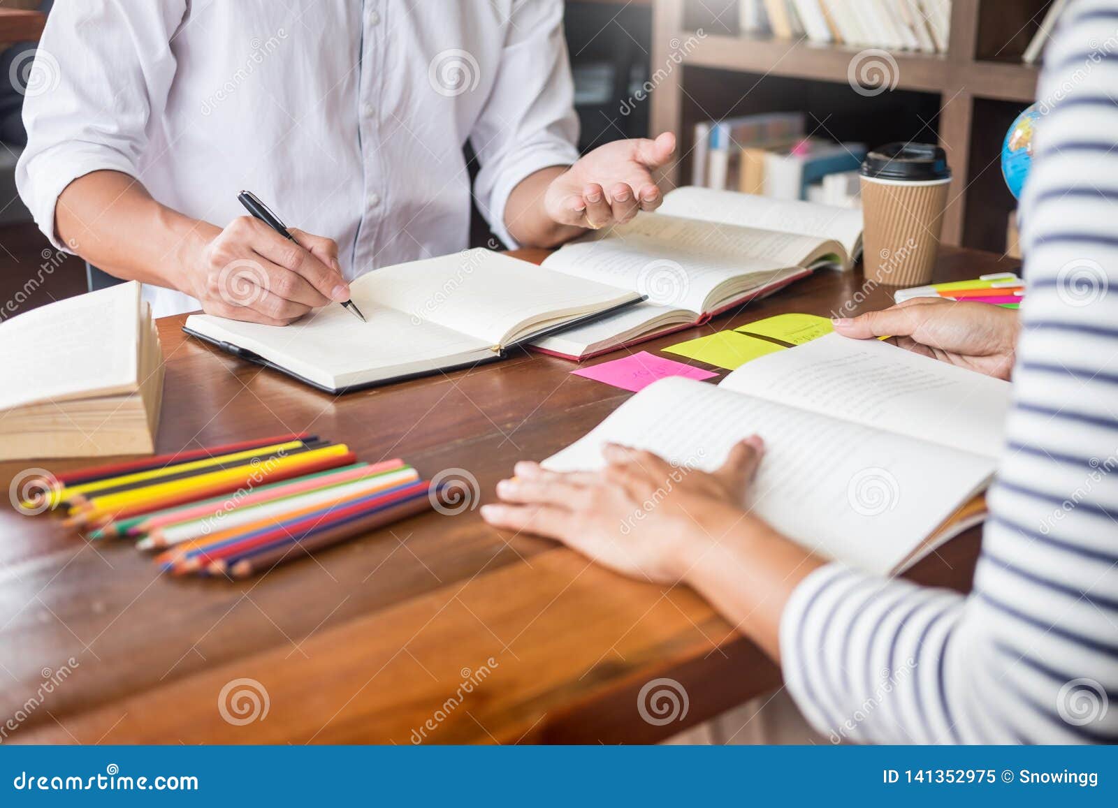Young Students Classmates Help Friend Catching Up Workbook and Learning ...