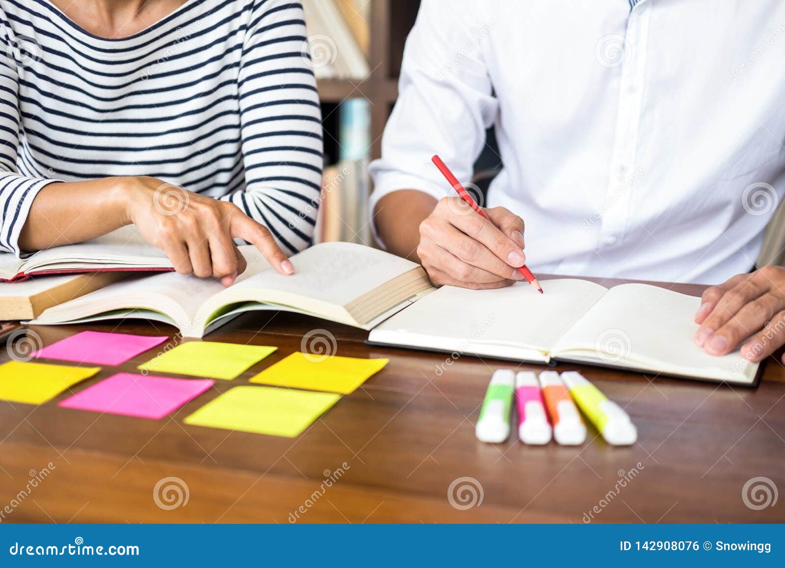 Young Students Classmates Help Friend Catching Up Workbook and Learning ...