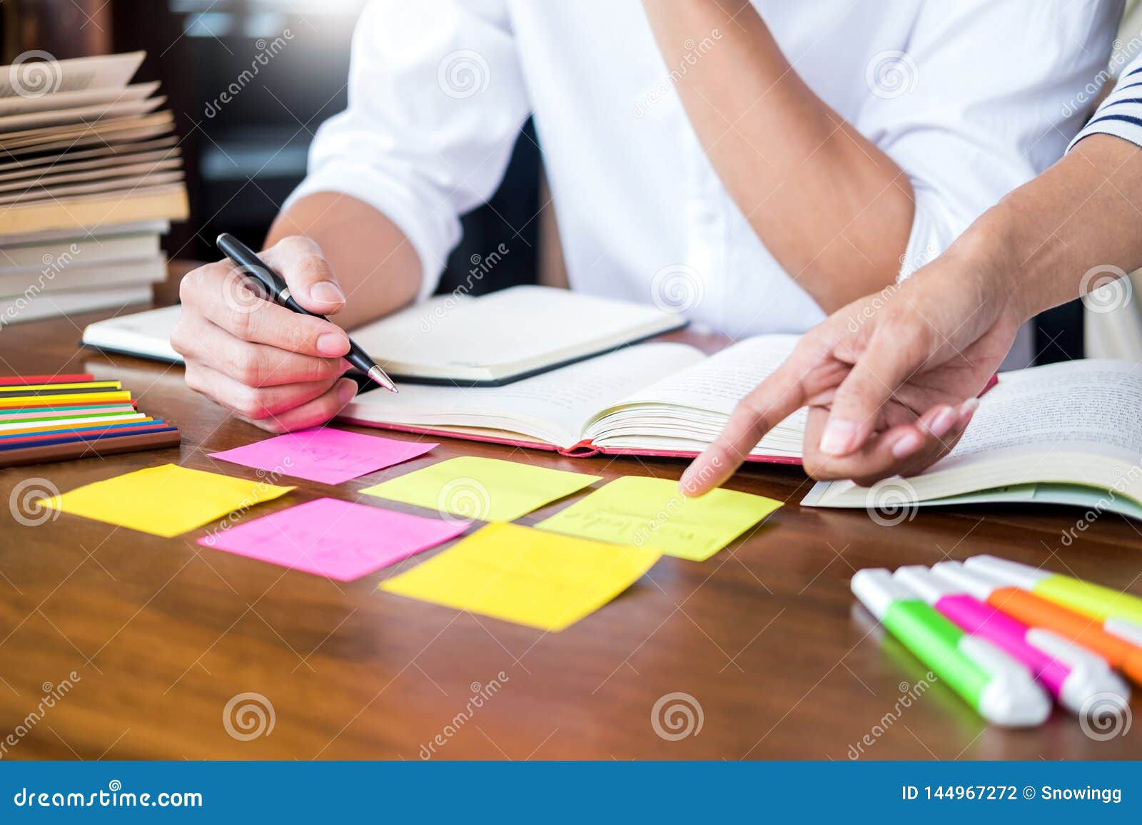 Young Students Classmates Help Friend Catching Up Workbook and Learning ...