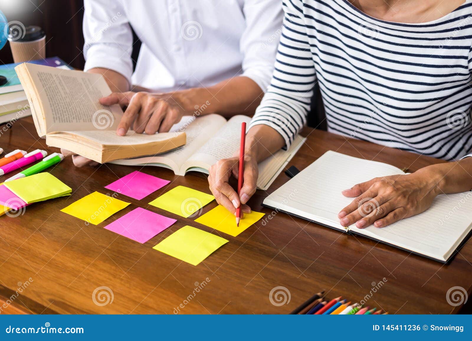 Young Students Classmates Help Friend Catching Up Workbook and Learning ...