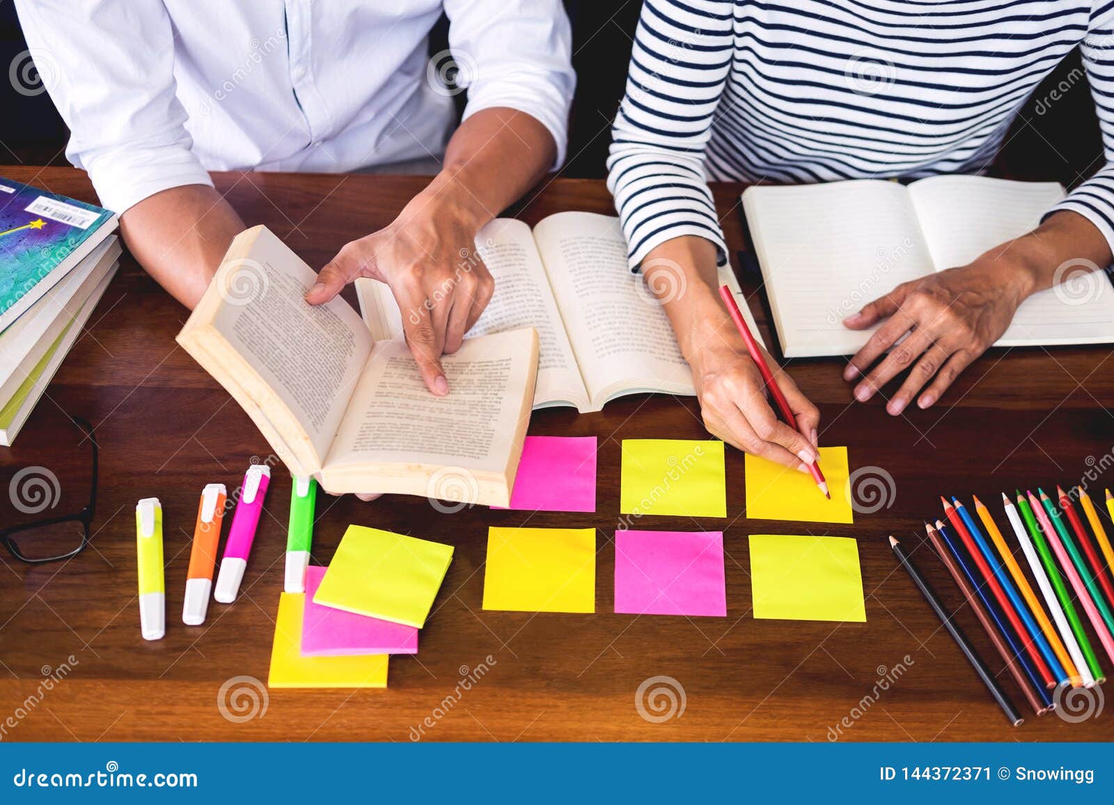 Young Students Classmates Help Friend Catching Up Workbook and Learning ...