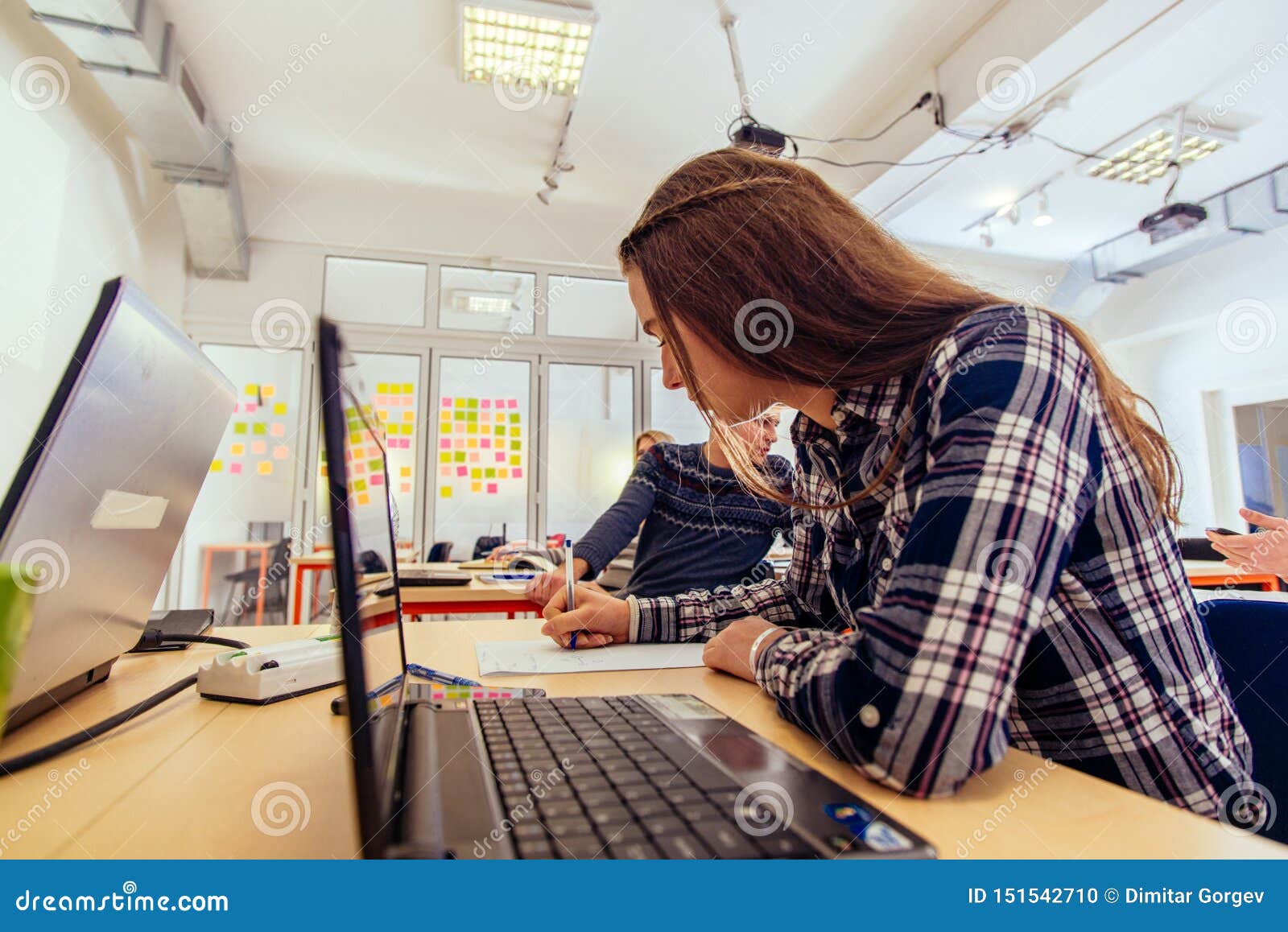 Students writing on class stock photo. Image of knowledge - 151542710