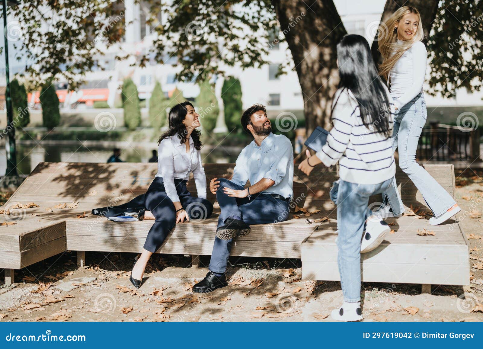 Young Students Collaborating in a Park, Discussing Topics, Doing ...